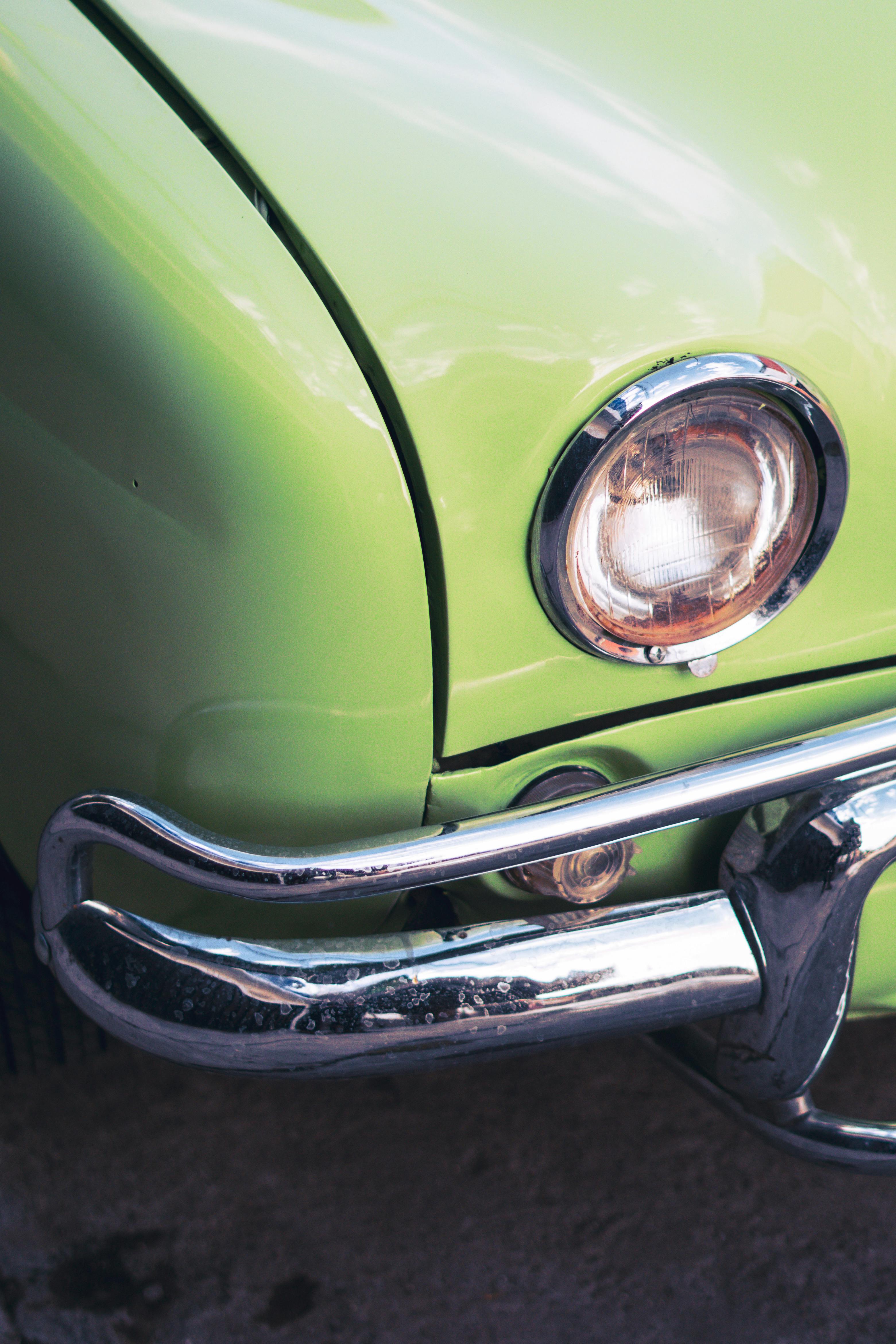 Close-up of Vintage Green Car Front Detail · Free Stock Photo