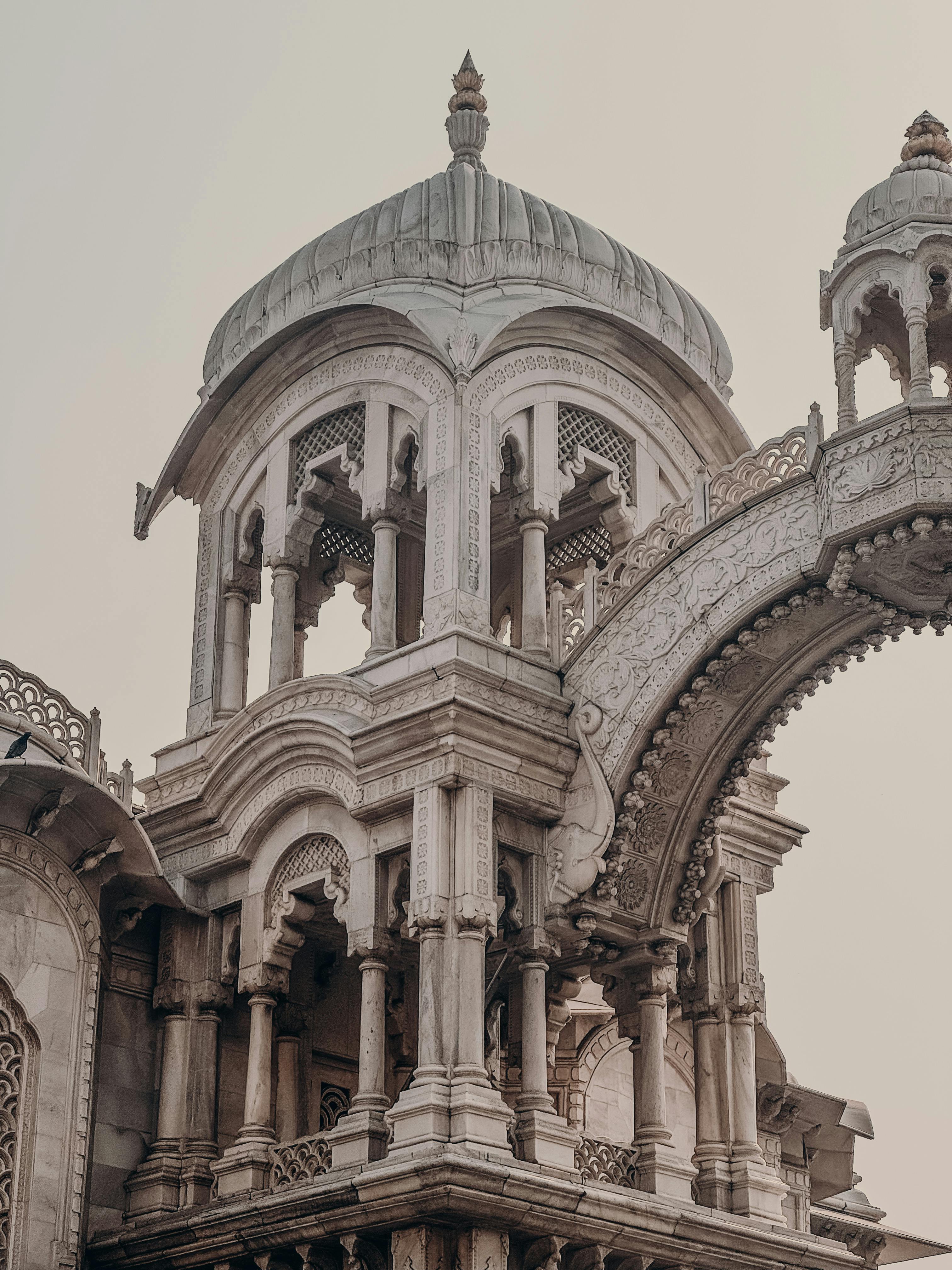 Ornate Architectural Tower with Arched Design · Free Stock Photo