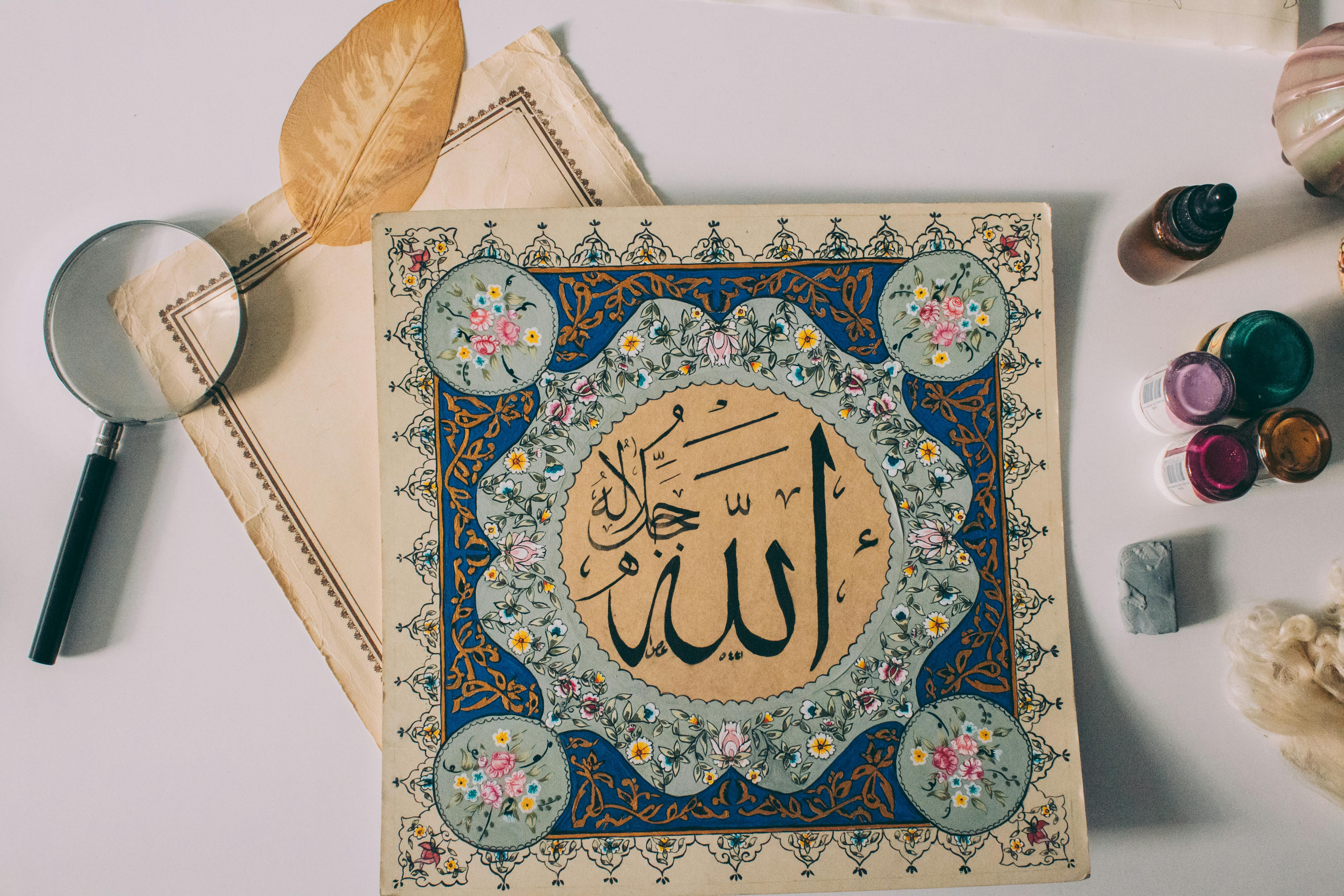 Intricate Islamic Calligraphy Art with Tools · Free Stock Photo