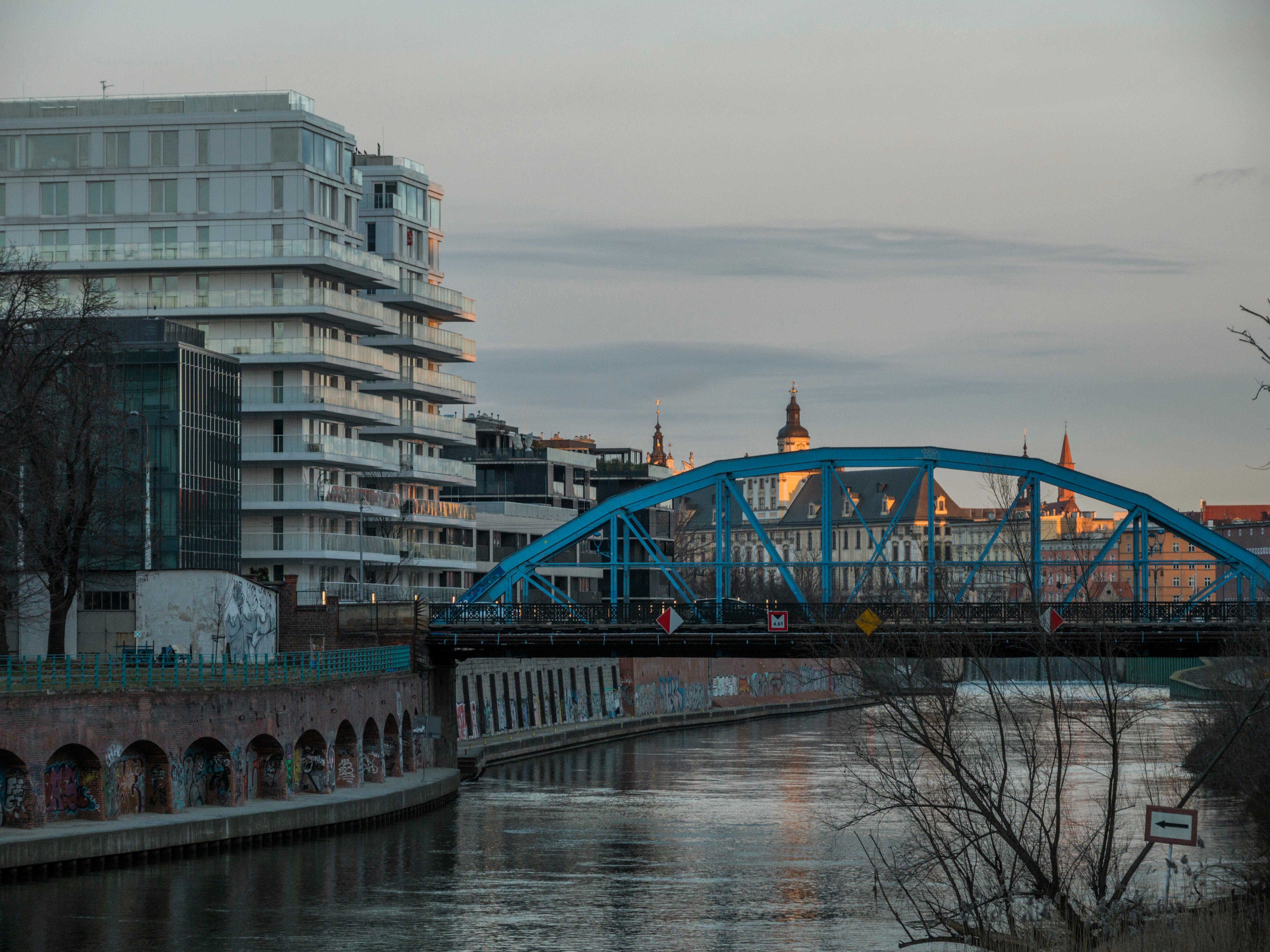 Scenic View of Wrocław's Blue Steel Bridge at Sunset · Free Stock Photo