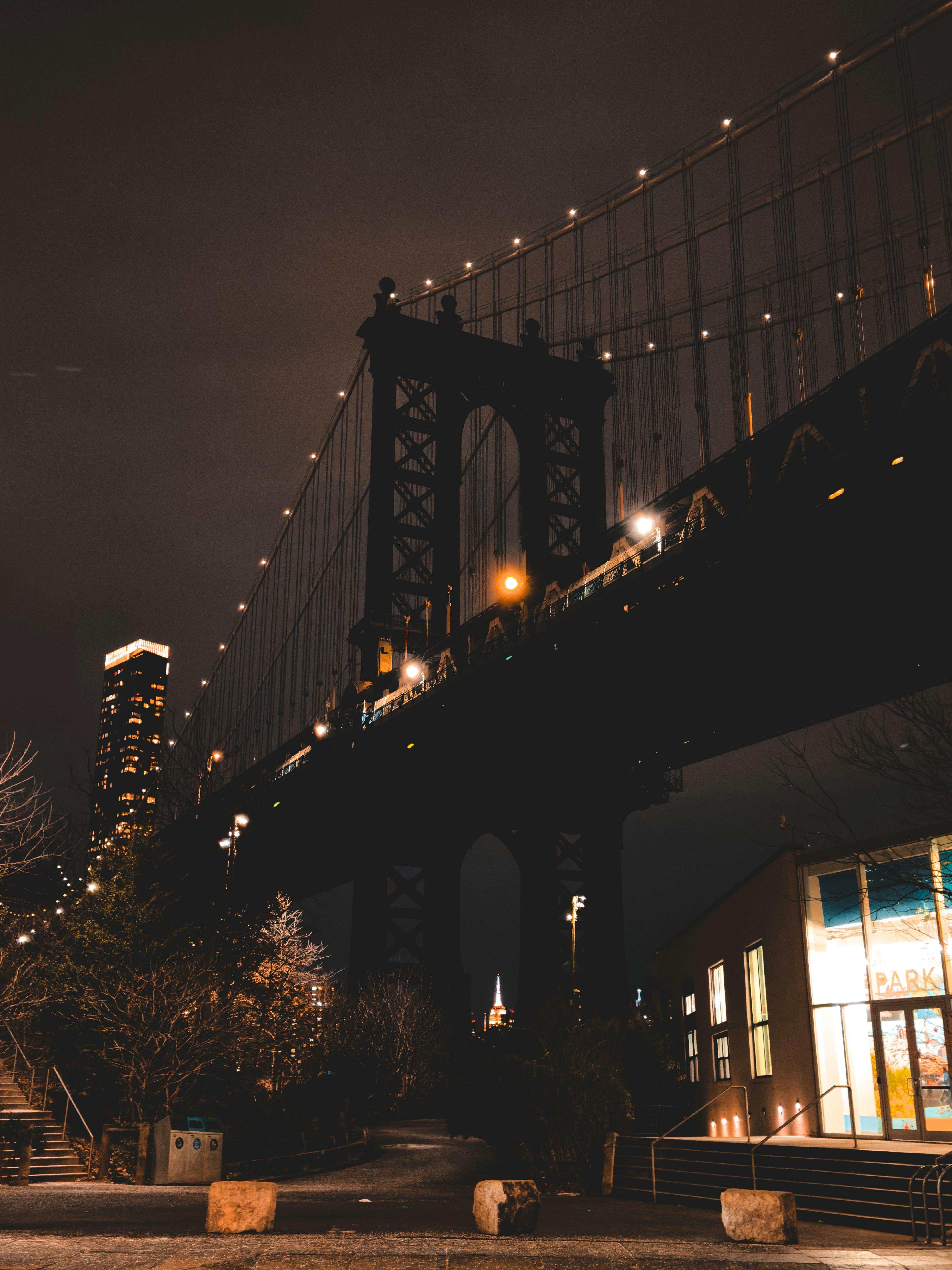Night view of bridge and city lights from below · Free Stock Photo