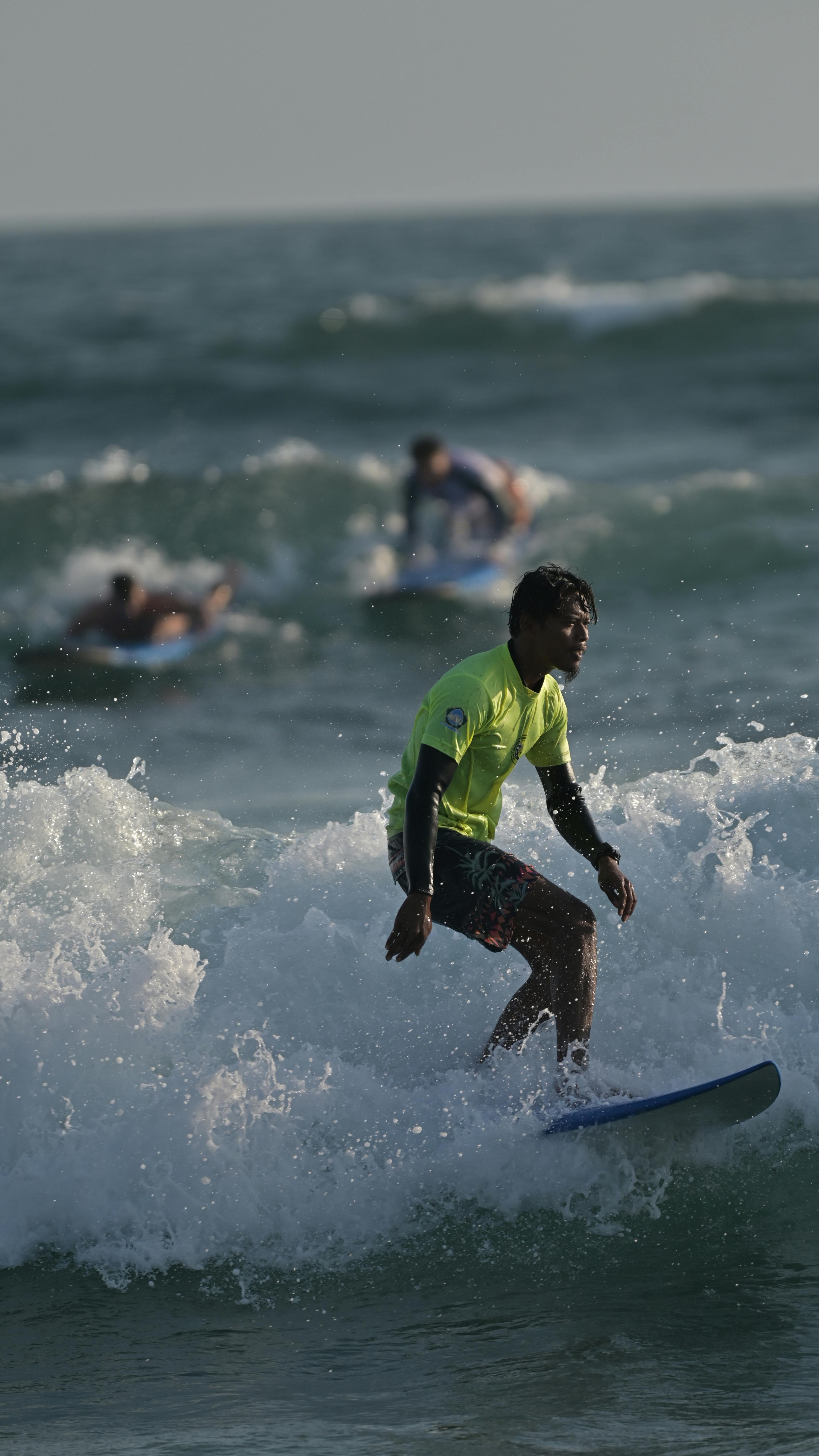 Dynamic Surfing Adventure in Bali's Waves · Free Stock Photo