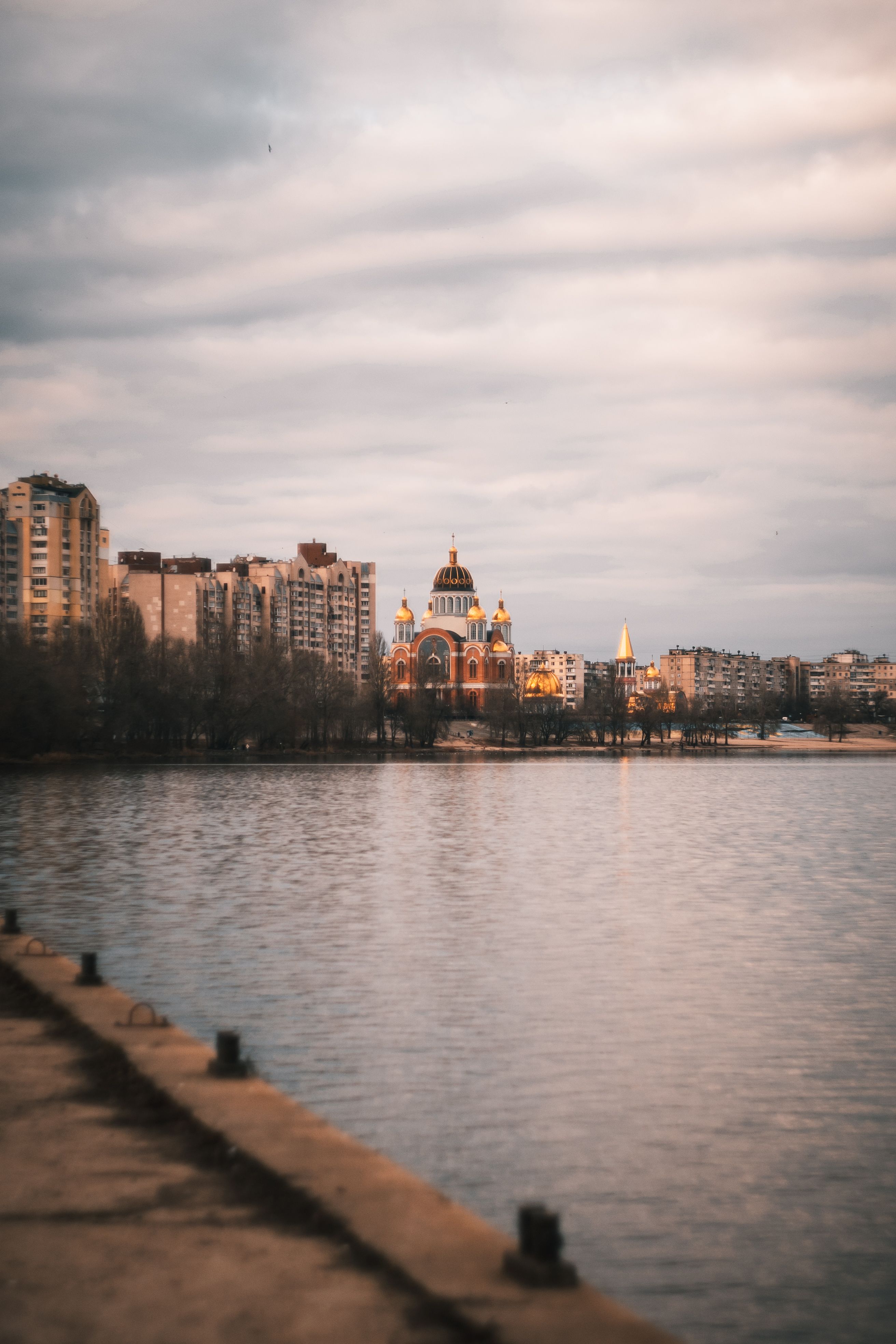 Scenic Lakeside View with City Skyline and Church · Free Stock Photo