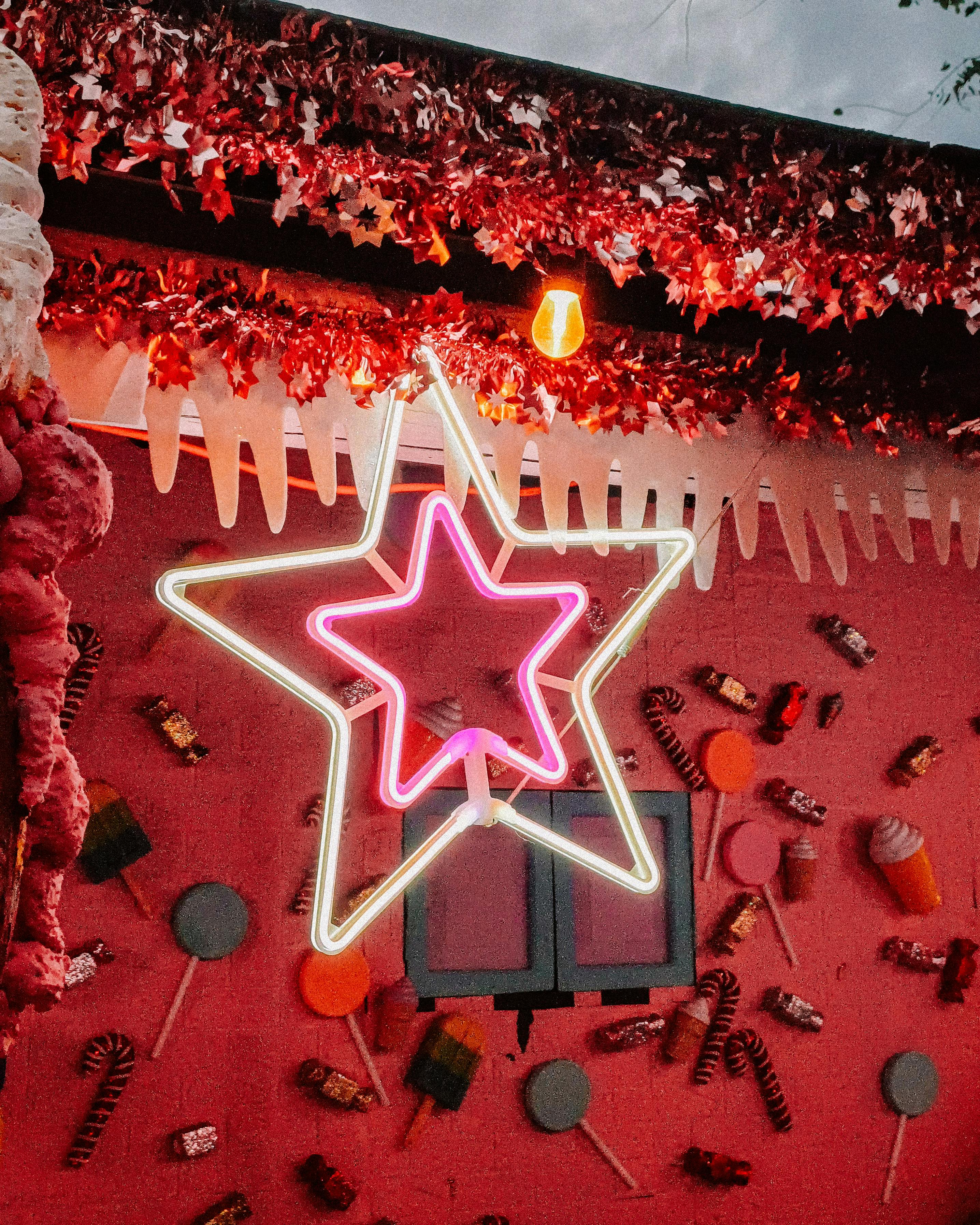 Vibrant Neon Star Decoration at Night Party · Free Stock Photo