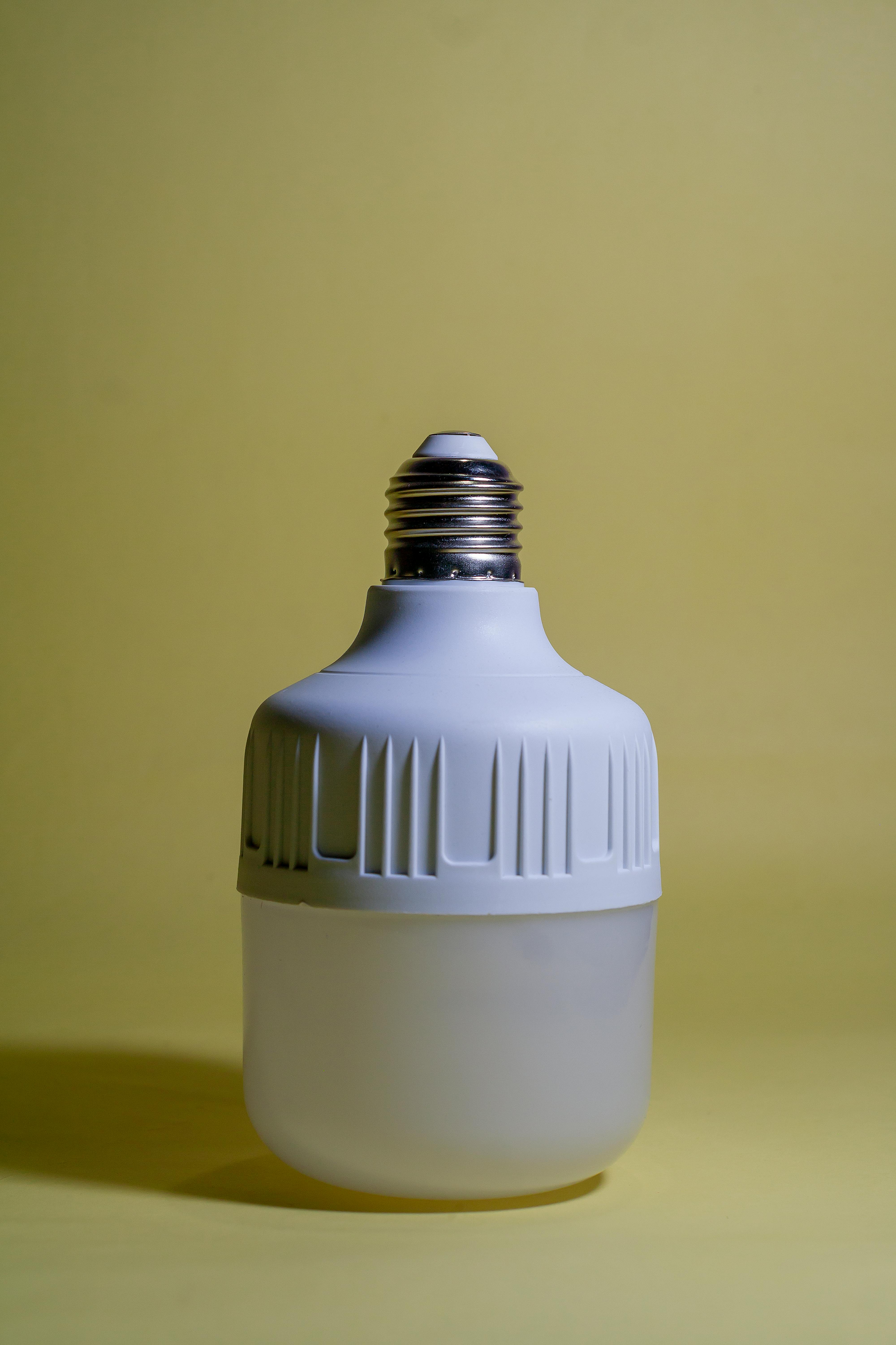 Modern Minimalist LED Bulb on Yellow Background · Free Stock Photo