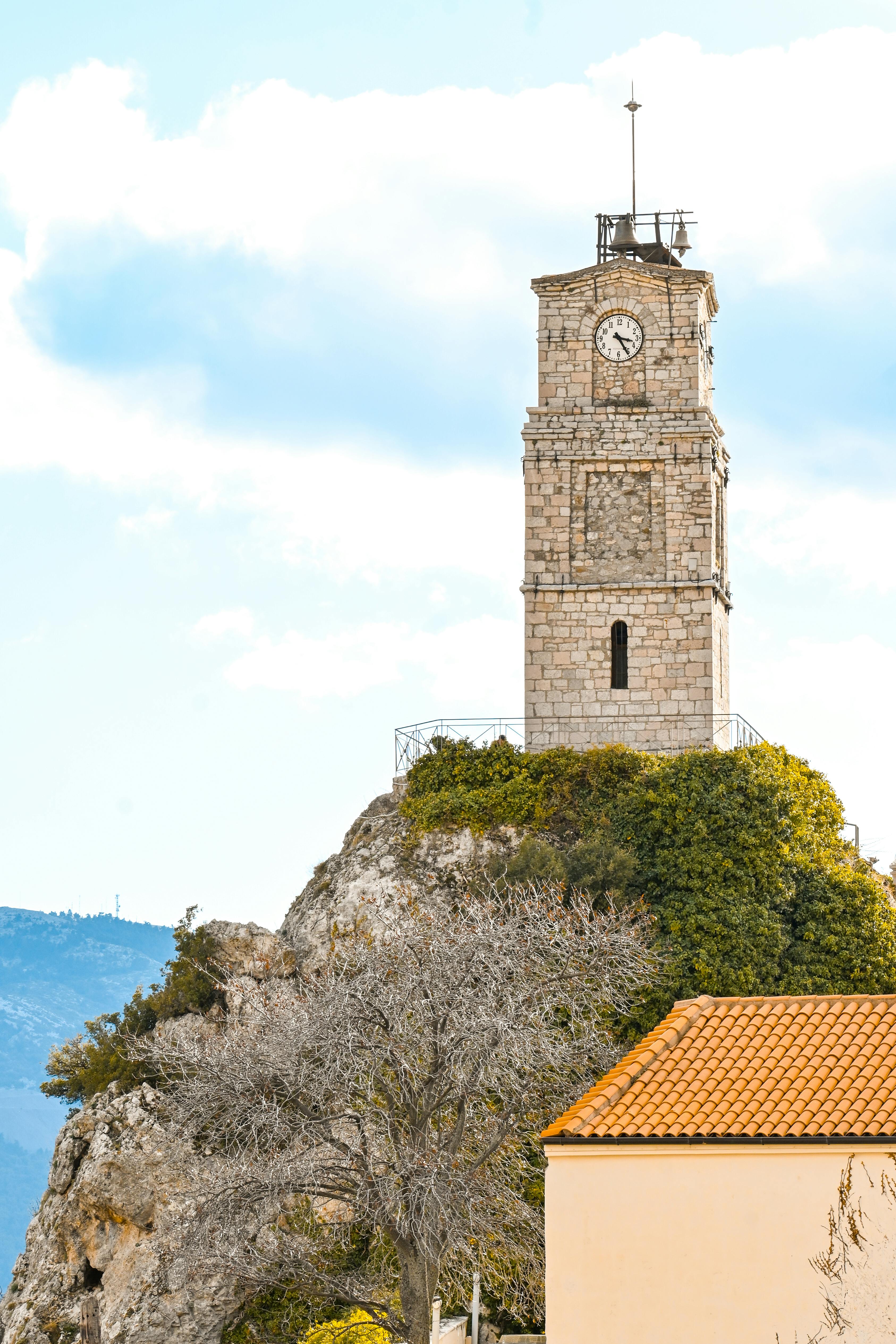Clock Tower in Arachova, Greece Under Blue Skies · Free Stock Photo
