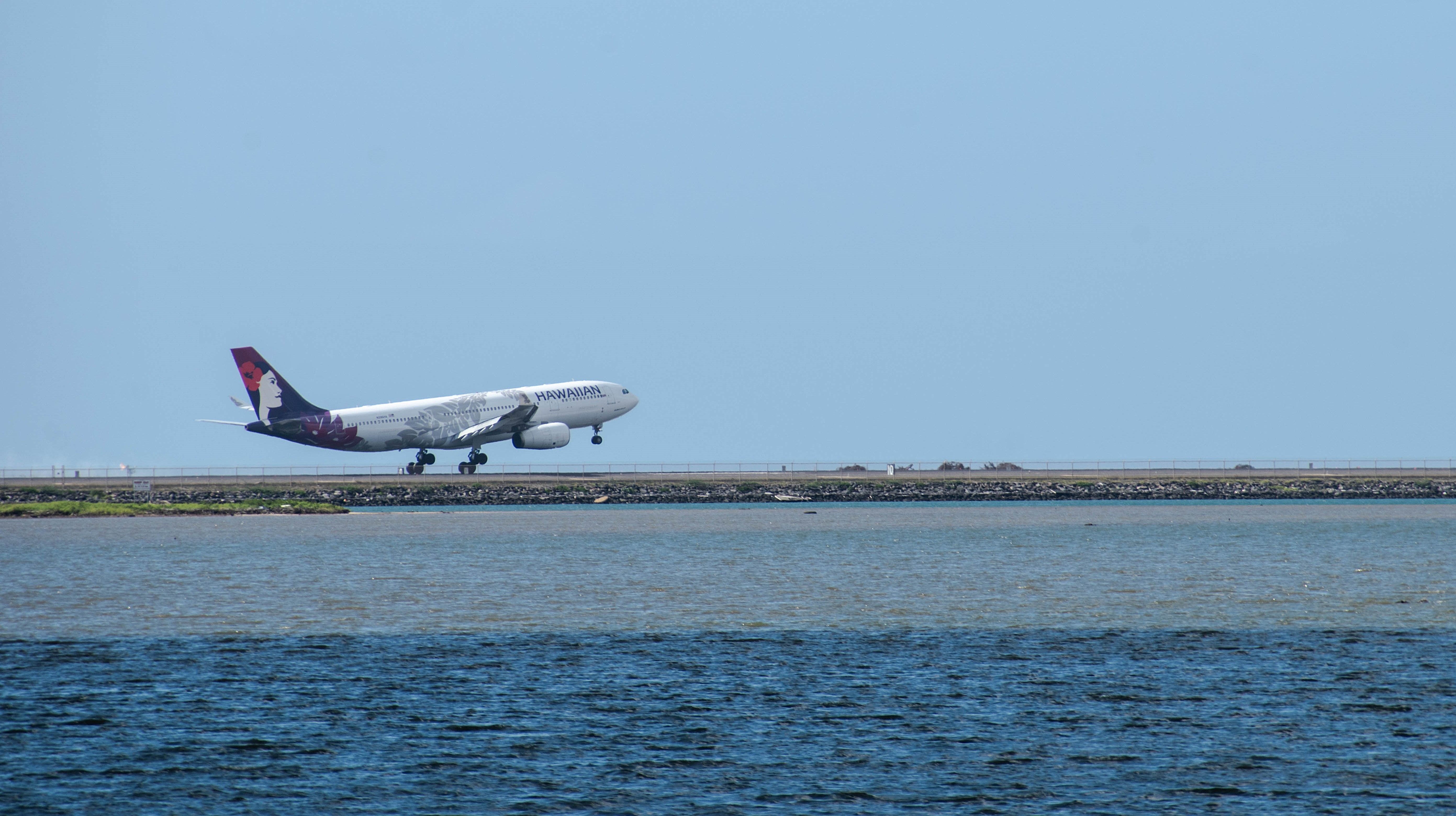 Passenger Plane Taking Off Over Ocean · Free Stock Photo