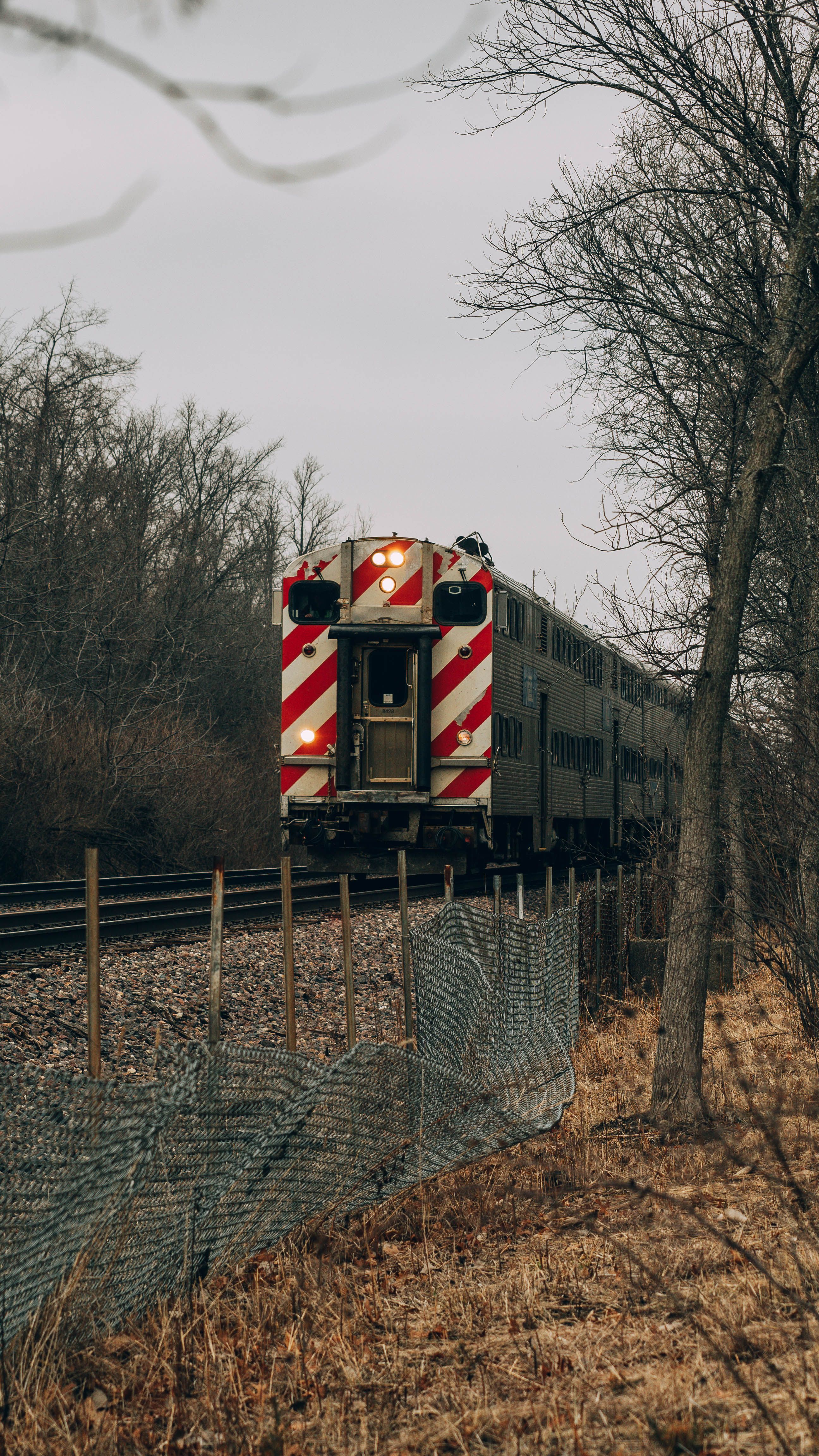 Family Stroll at Car Meet with Train Passing · Free Stock Photo