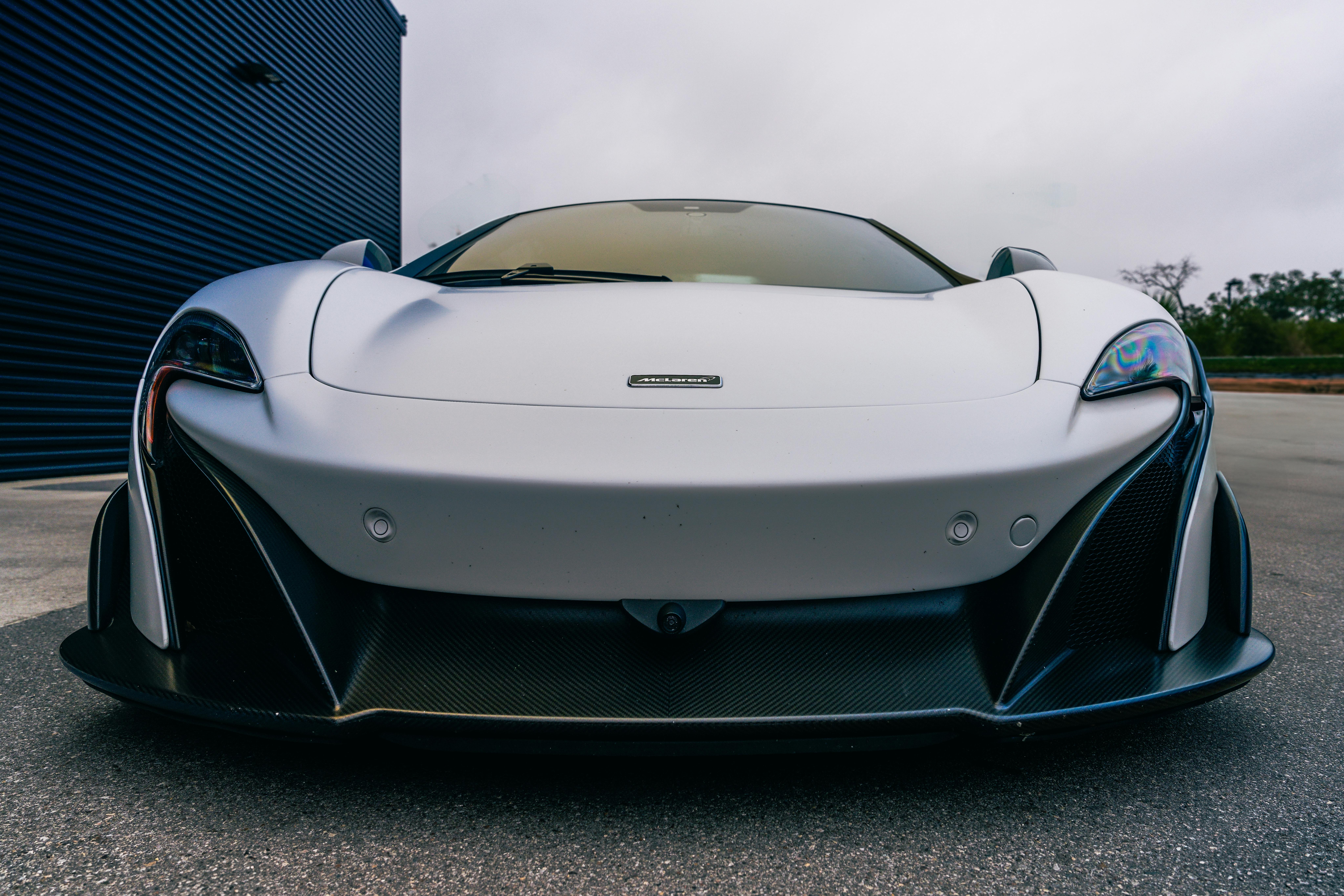 Front View of a Sleek Sports Car in Urban Setting · Free Stock Photo