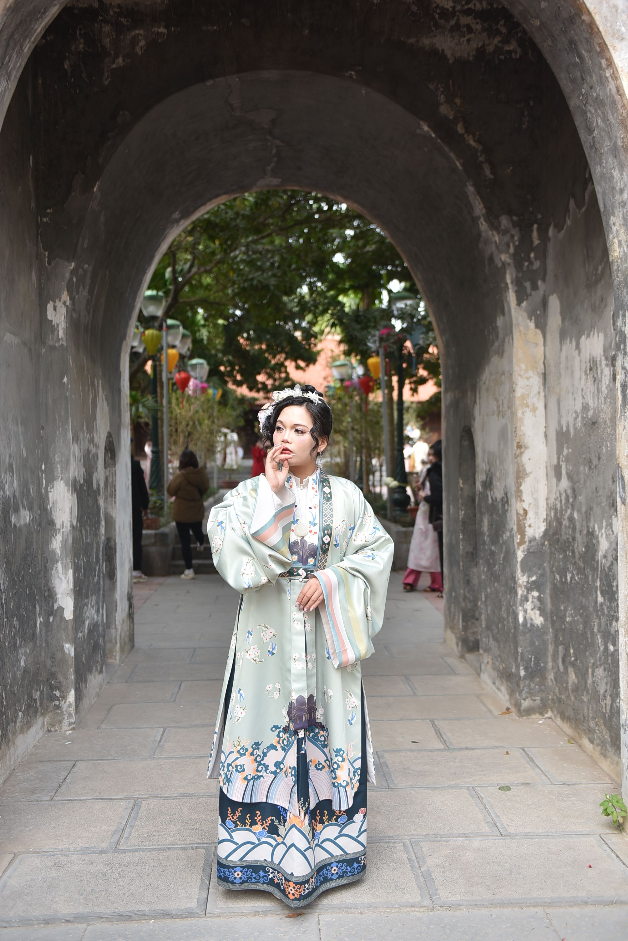 Traditional Chinese Dress in Historical Arched Pathway · Free Stock Photo