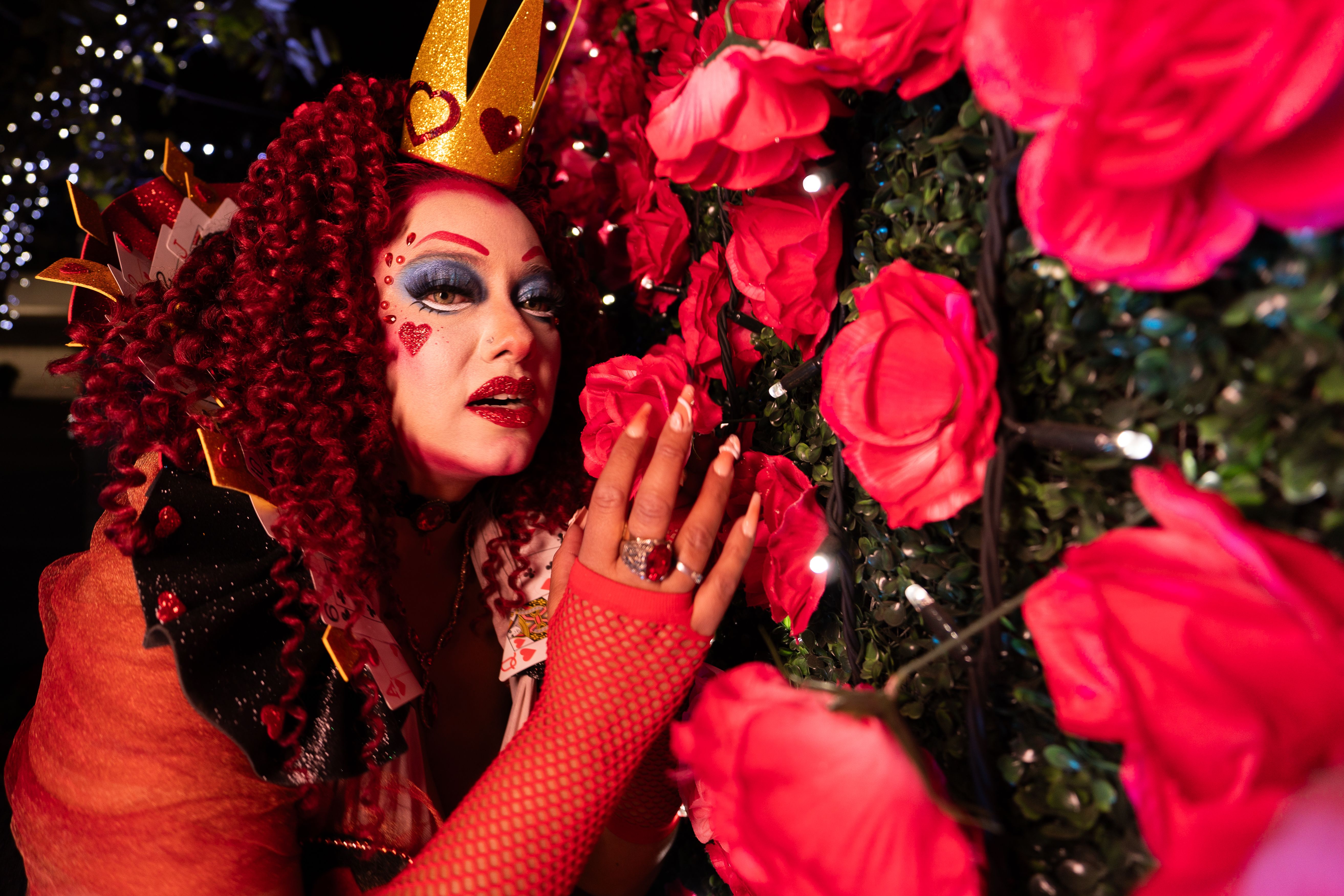 Vibrant Cosplay of a Queen Amongst Roses · Free Stock Photo