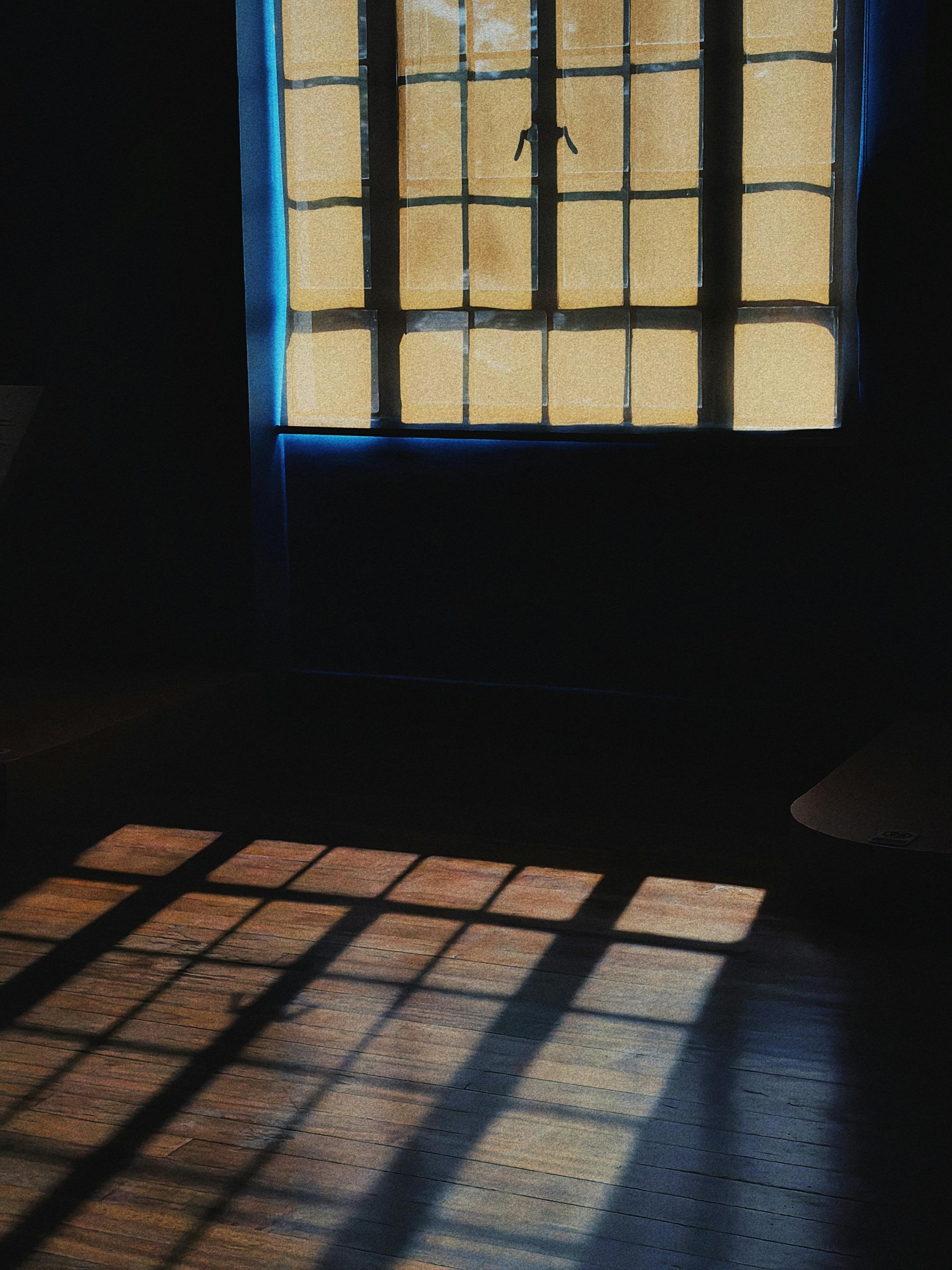 Sunlight Casting Shadows Through Vintage Window · Free Stock Photo