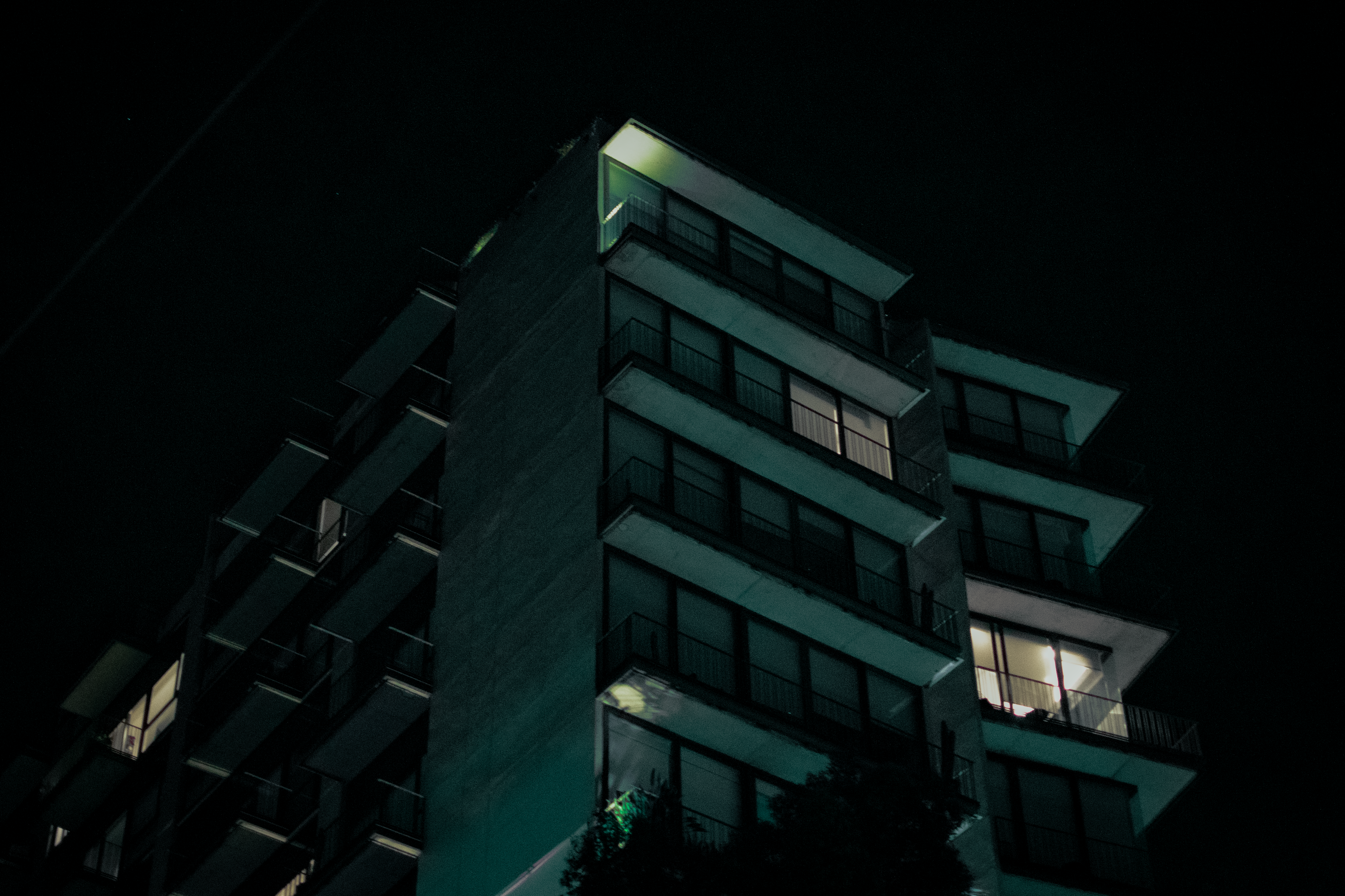 Modern building exterior at night with lights · Free Stock Photo