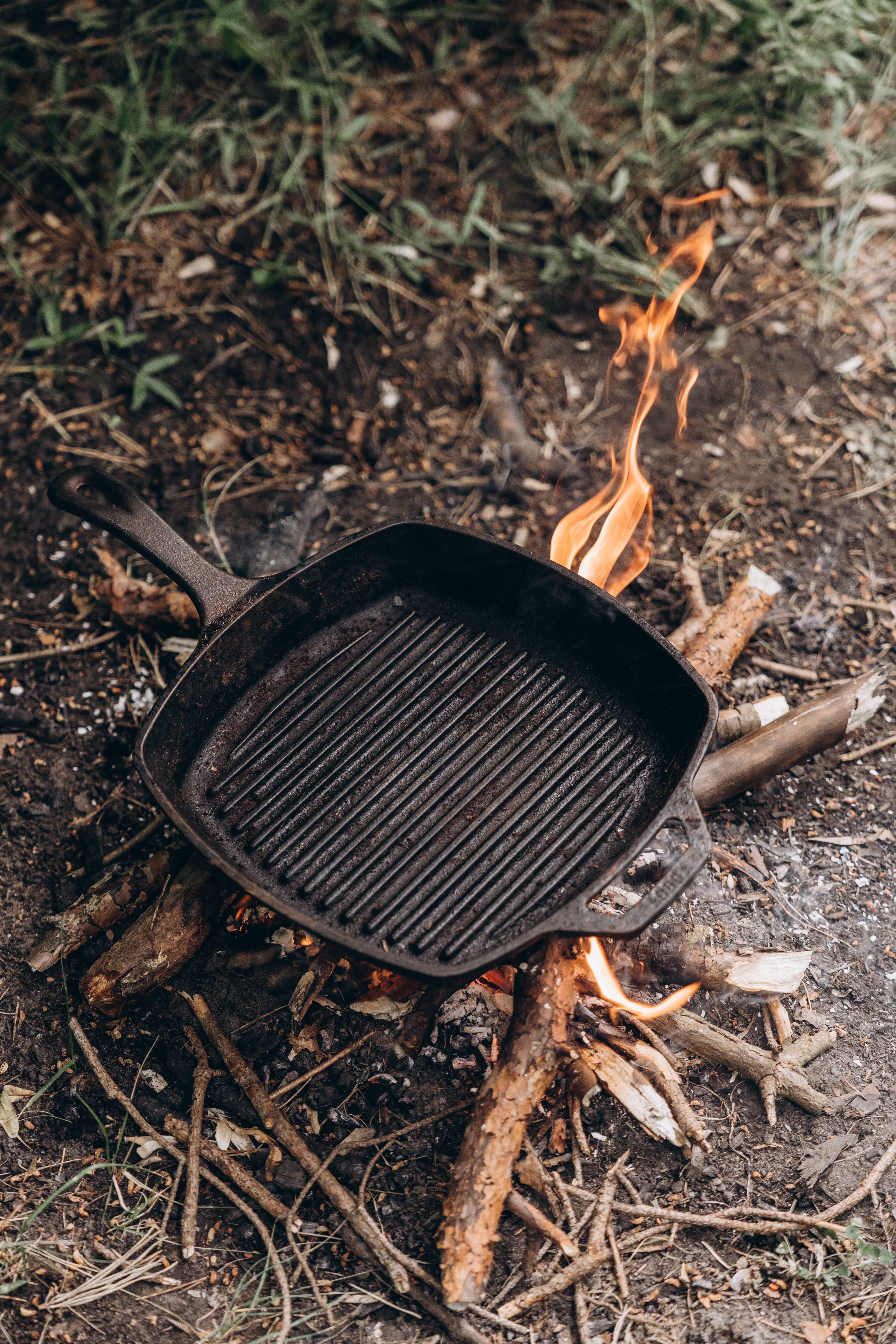 Cast Iron Grill Pan Over Open Campfire Outdoors · Free Stock Photo