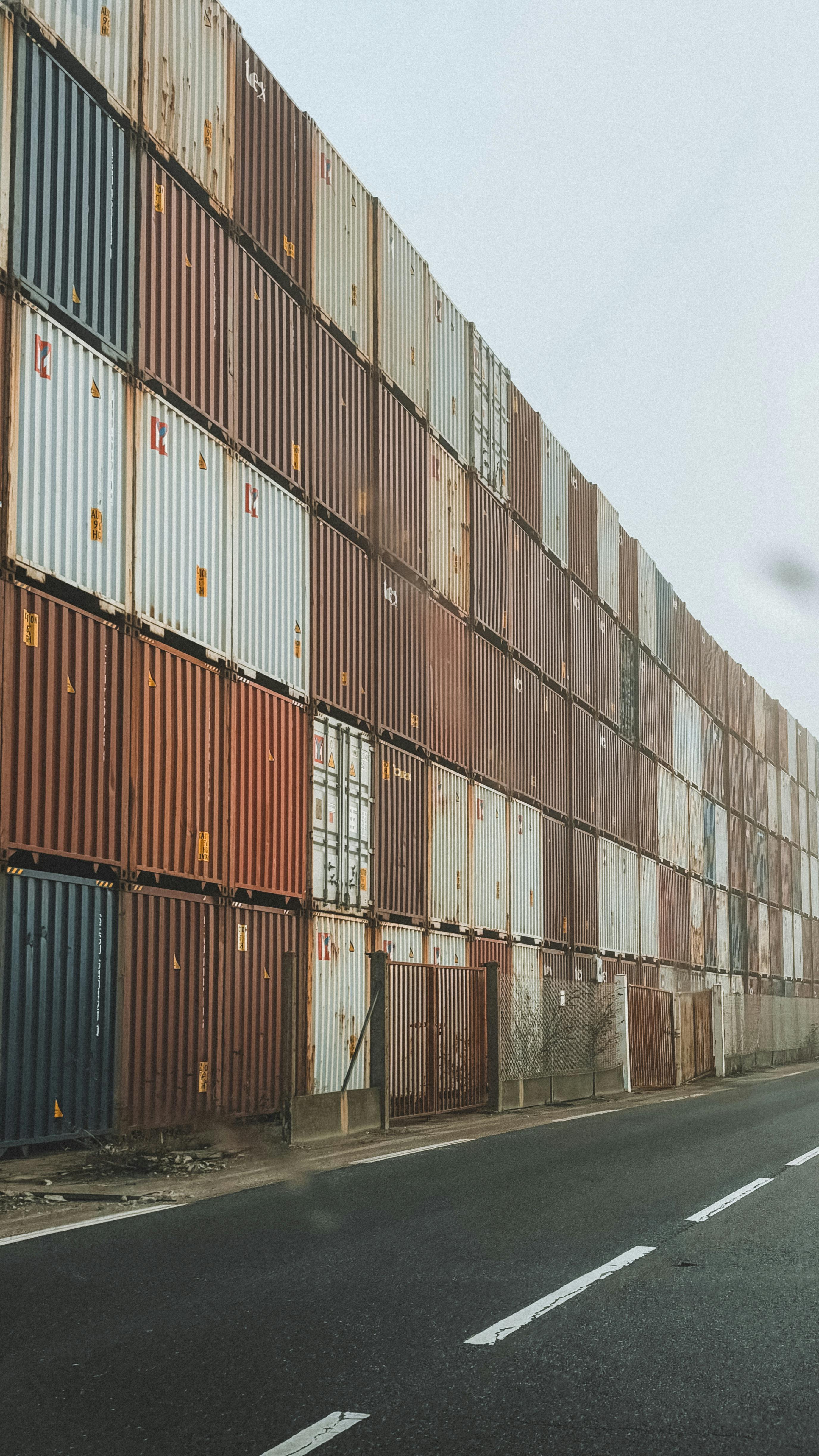 Stacked Shipping Containers at Freight Yard · Free Stock Photo