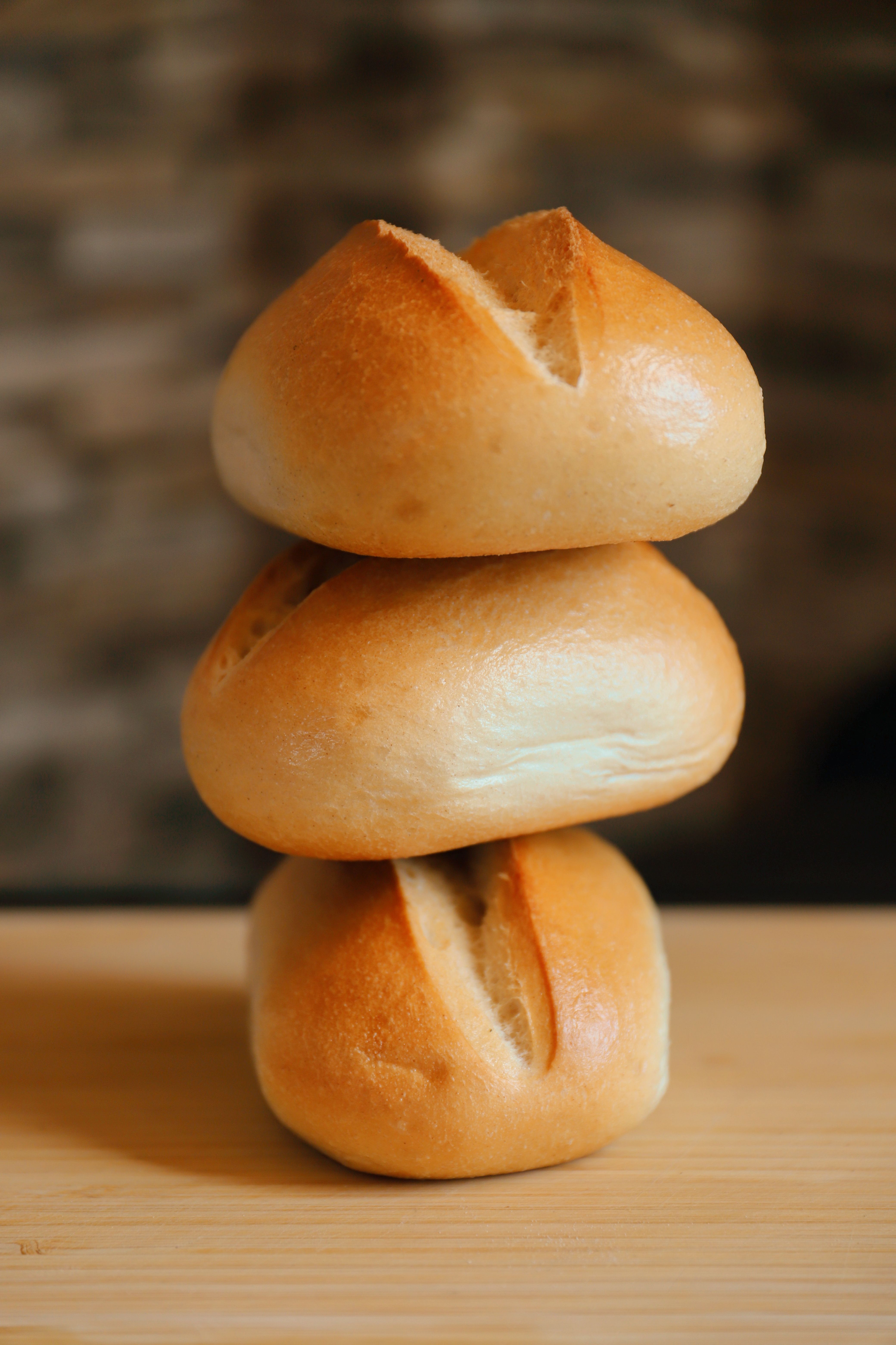 Artistic Bread Tower Still Life on Dark Background · Free Stock Photo