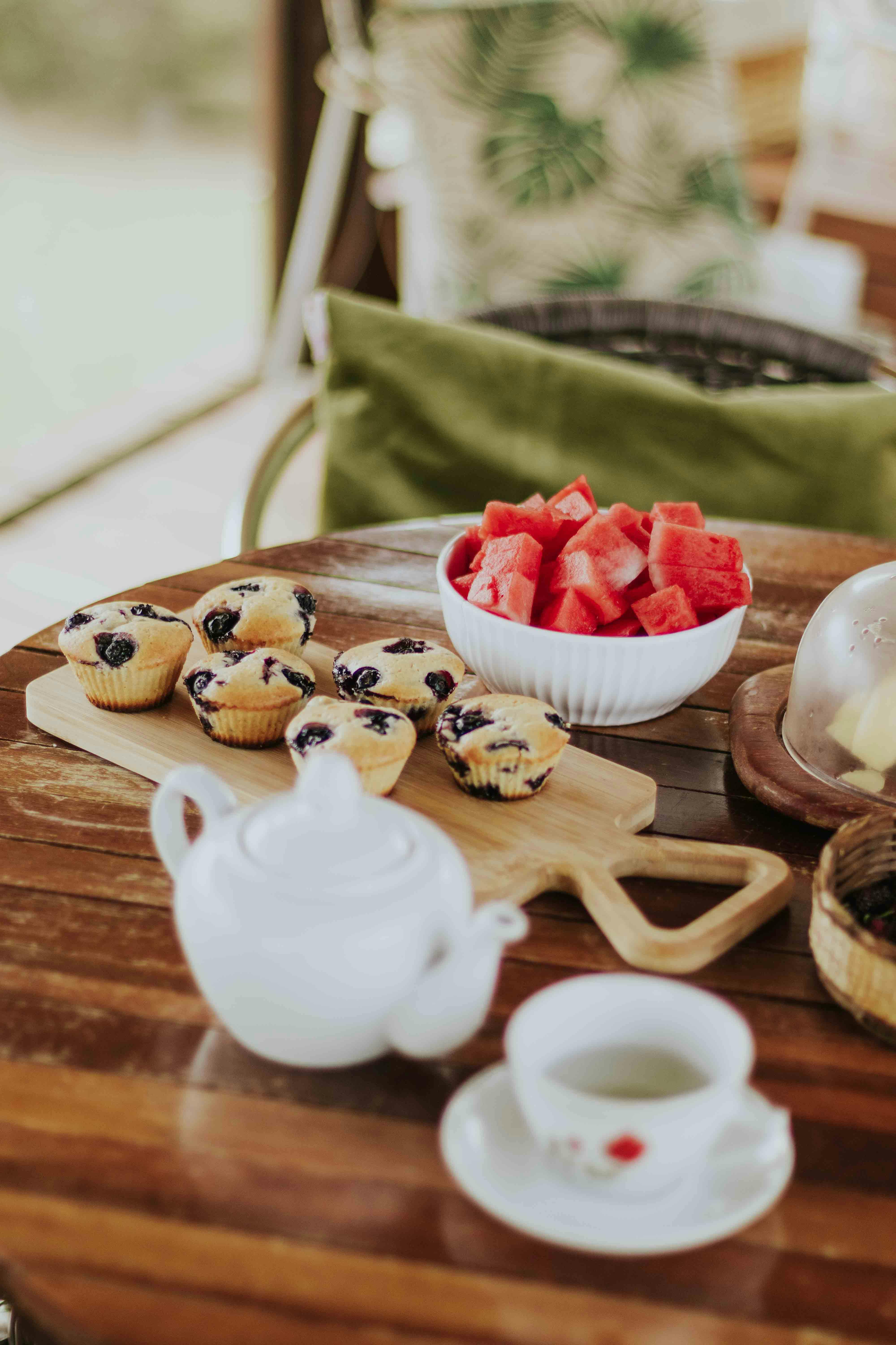 Cozy Breakfast Setup with Tea and Muffins · Free Stock Photo