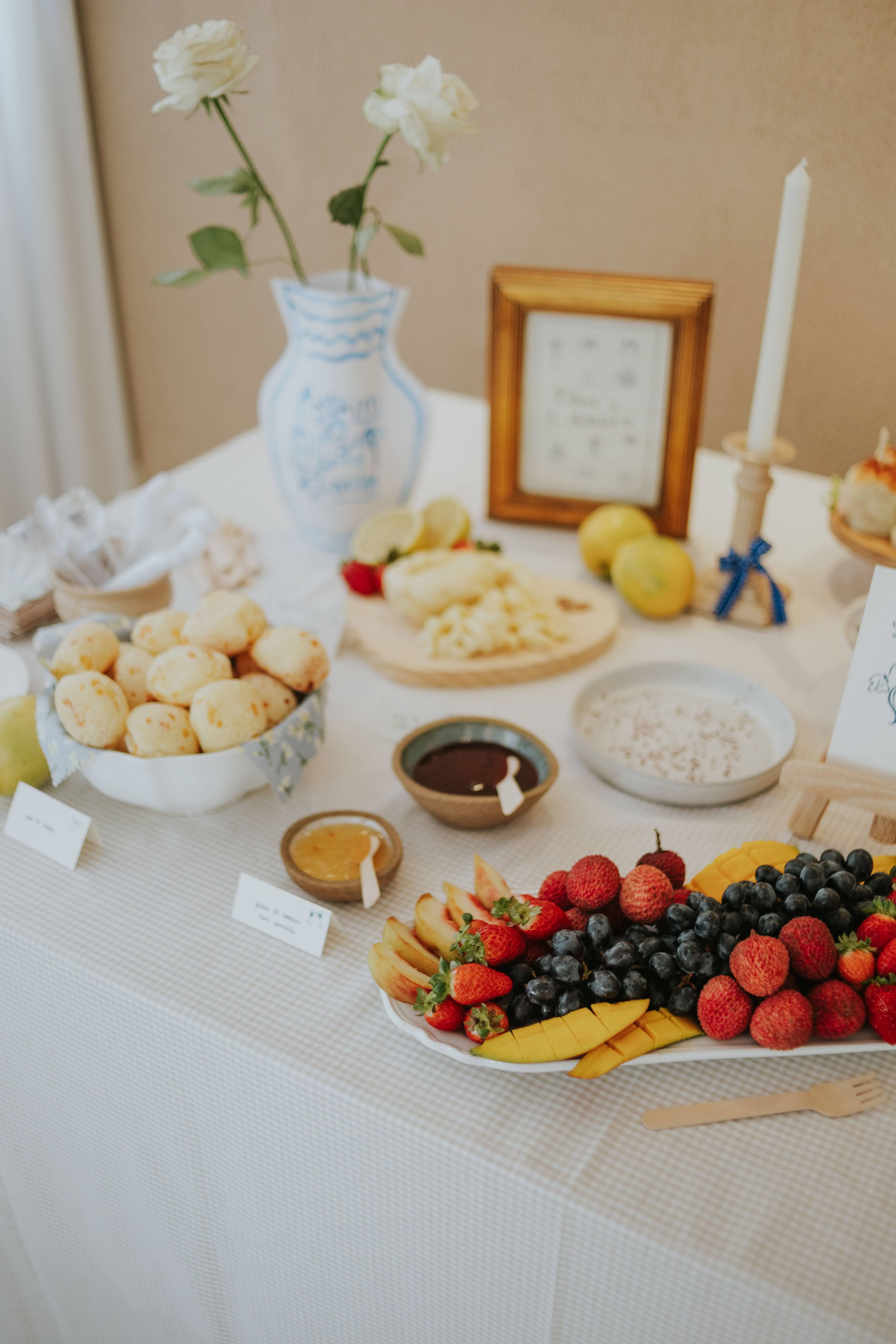 Elegant Table Setting with Fresh Fruits and Pastries · Free Stock Photo