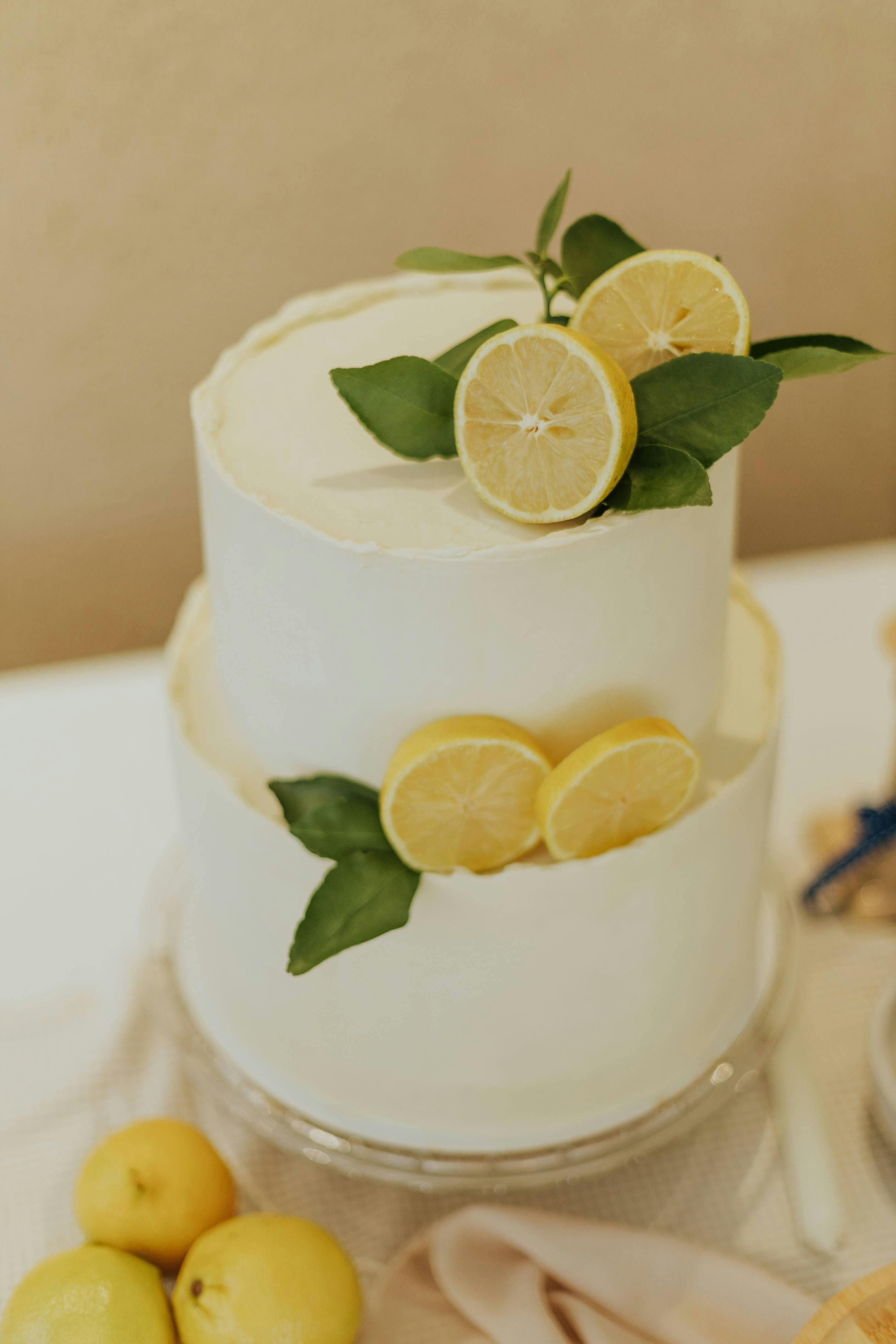 Elegant Lemon Cake with Fresh Citrus Garnish · Free Stock Photo