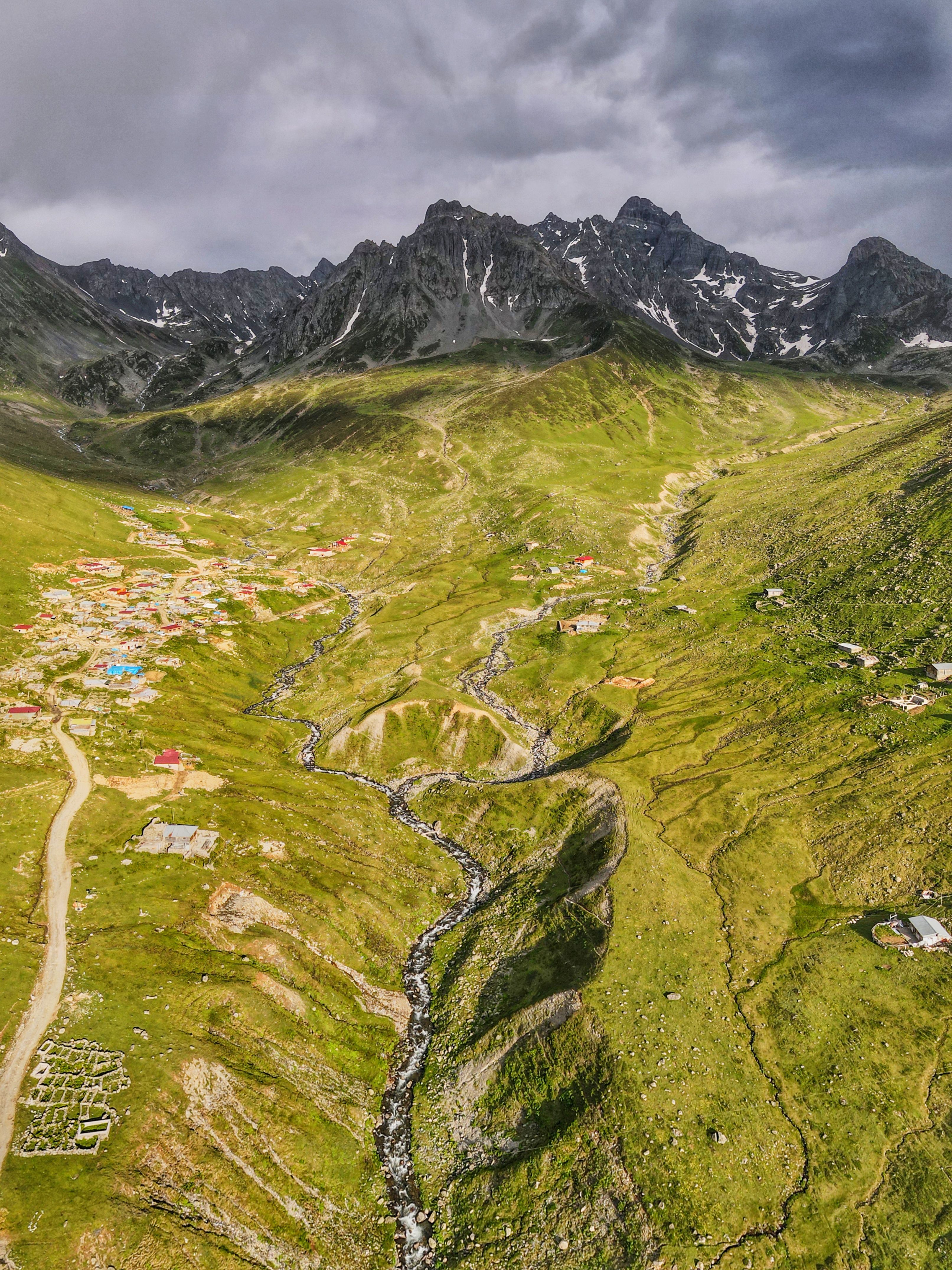 Scenic Aerial View of Mountain Valley and Stream · Free Stock Photo