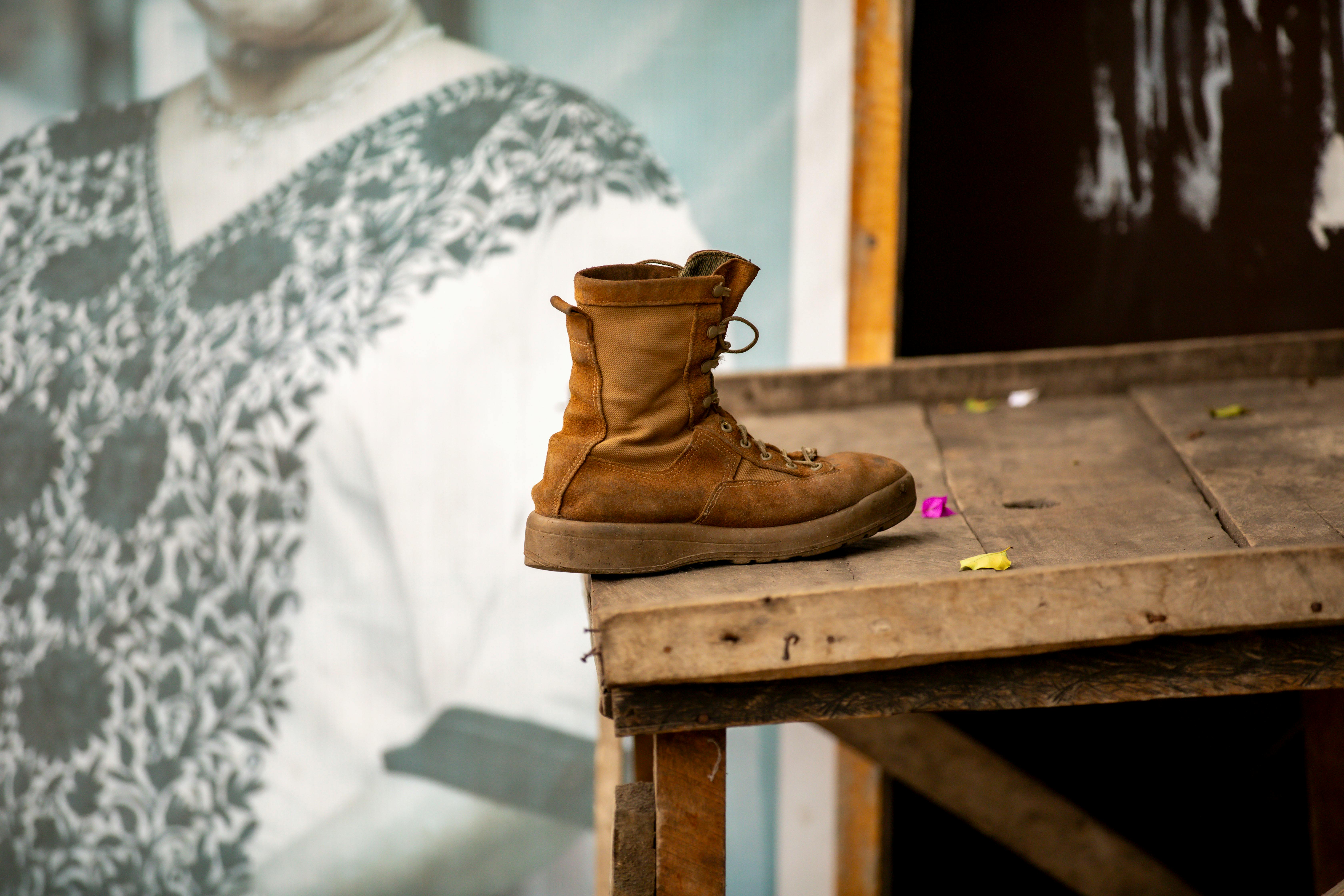 Rustic Boot on Wooden Table with Portrait Background · Free Stock Photo