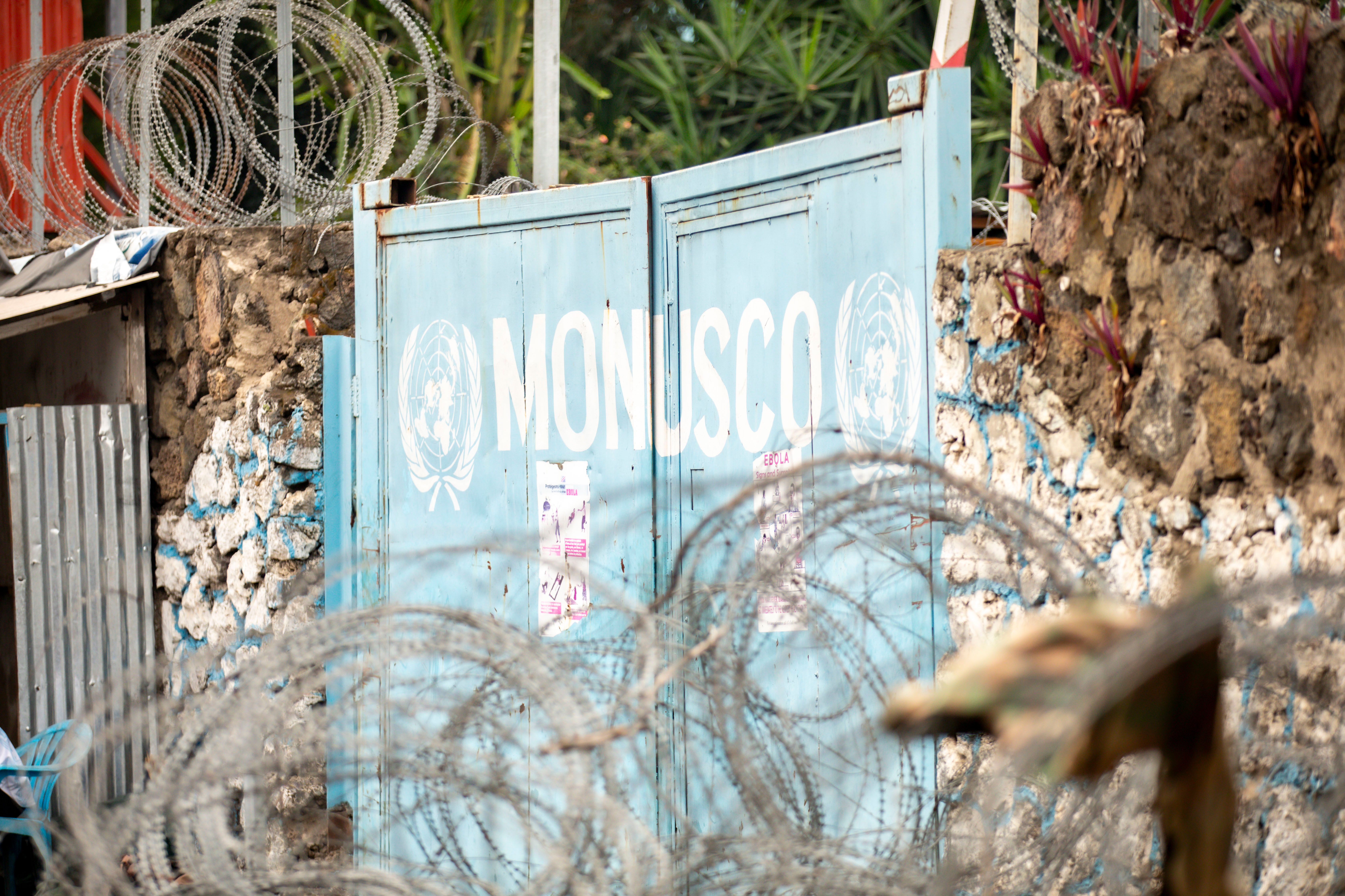 MONUSCO Gate with Barbed Wire and Stone Walls · Free Stock Photo