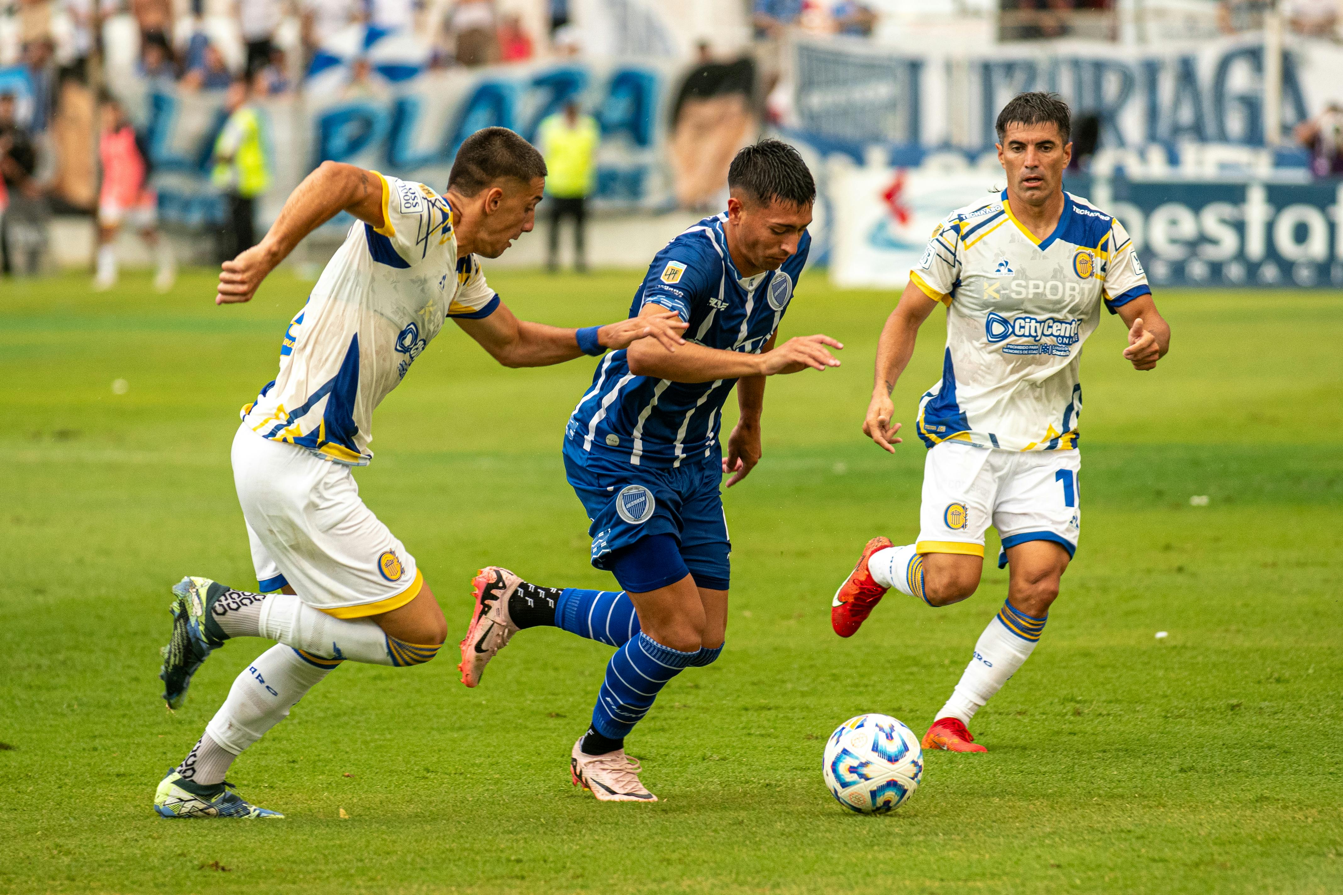 Intense Soccer Match Action on Green Field · Free Stock Photo