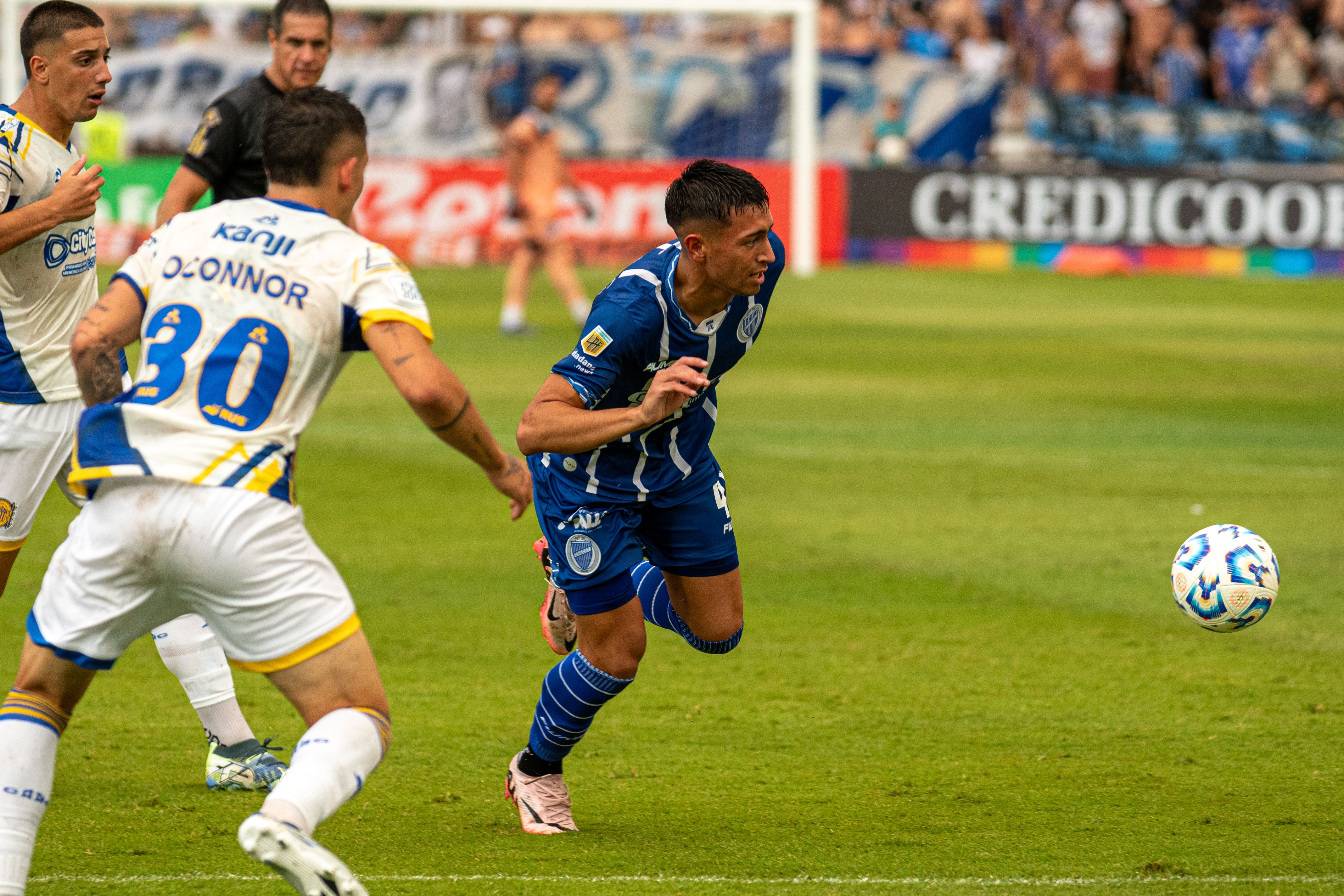 Intense Soccer Match Action with Players in Motion · Free Stock Photo