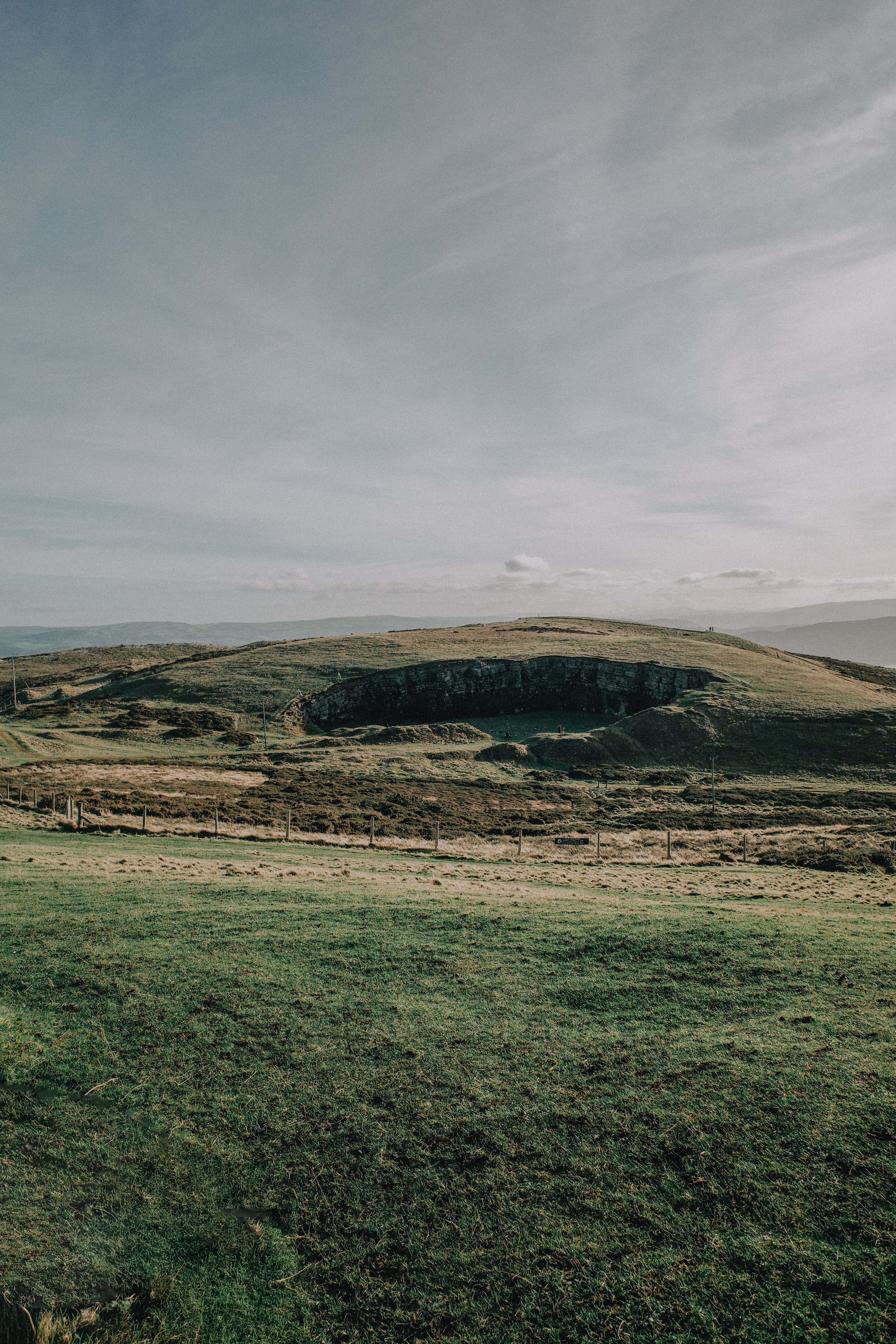 Serene Countryside Landscape under Overcast Sky · Free Stock Photo