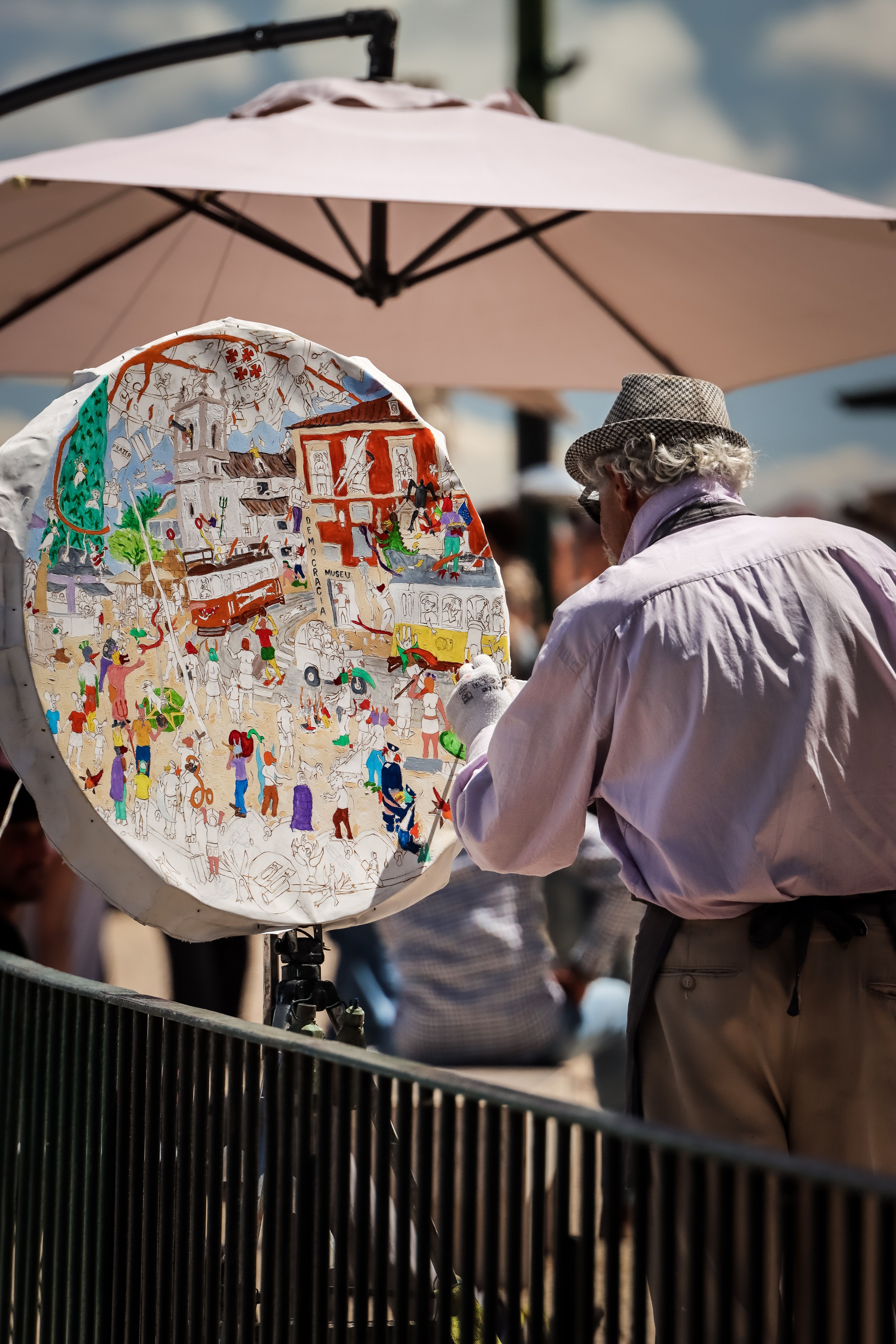 Outdoor Art Painter in Lisbon with Umbrella · Free Stock Photo