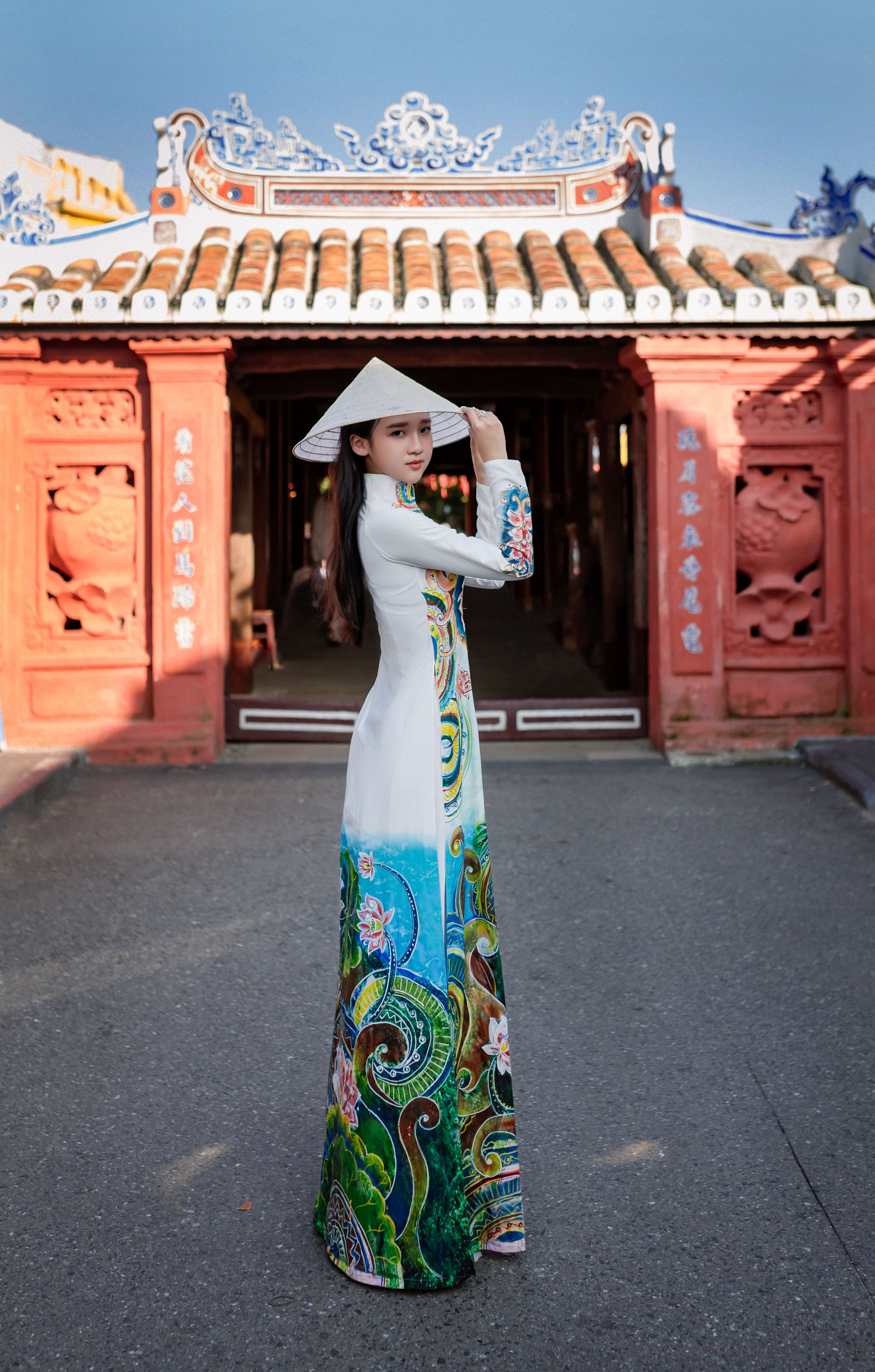 Vietnamese Woman in Ao Dai Poses at Hội An · Free Stock Photo