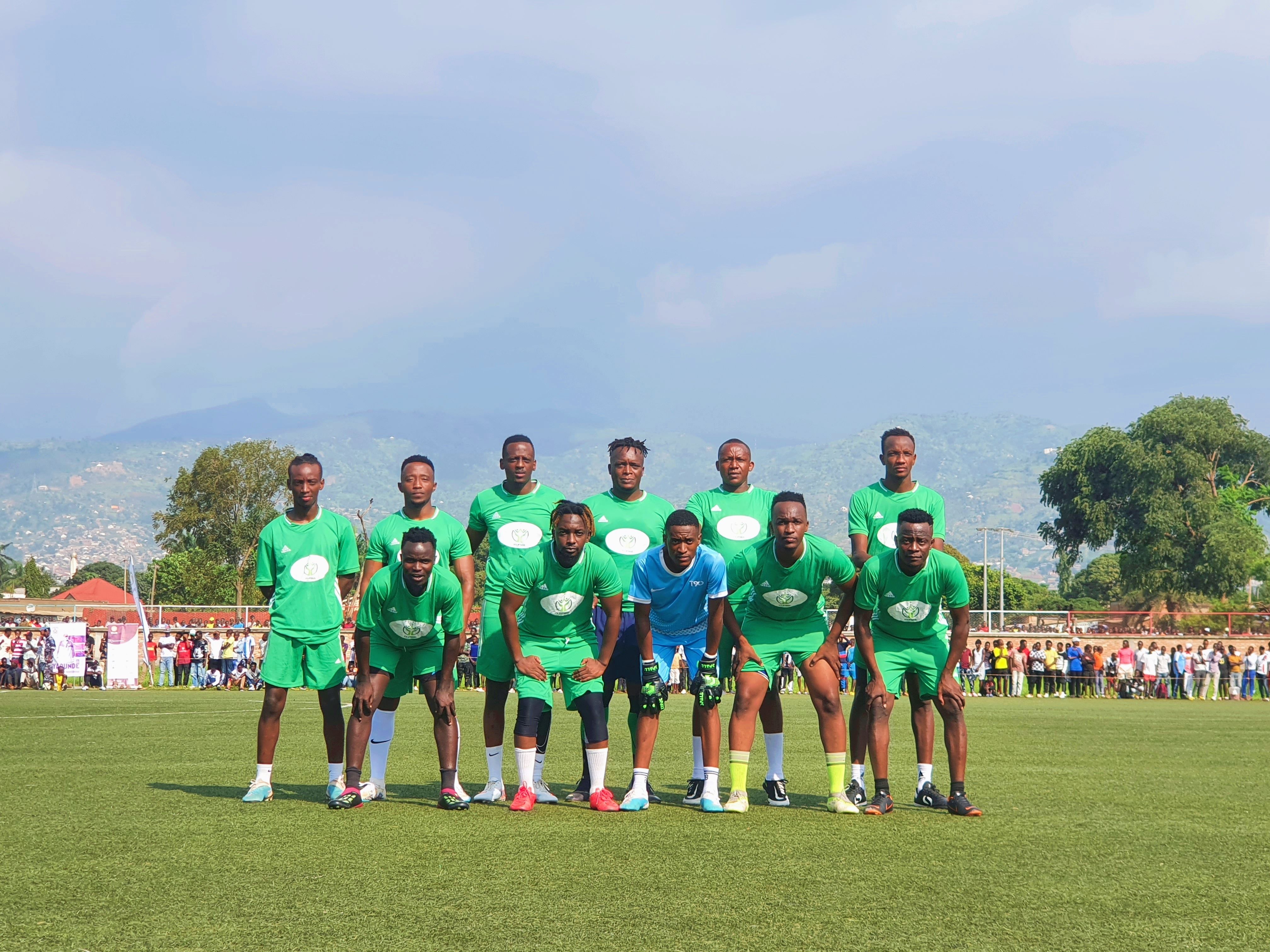 Soccer Team Posing on Outdoor Field · Free Stock Photo