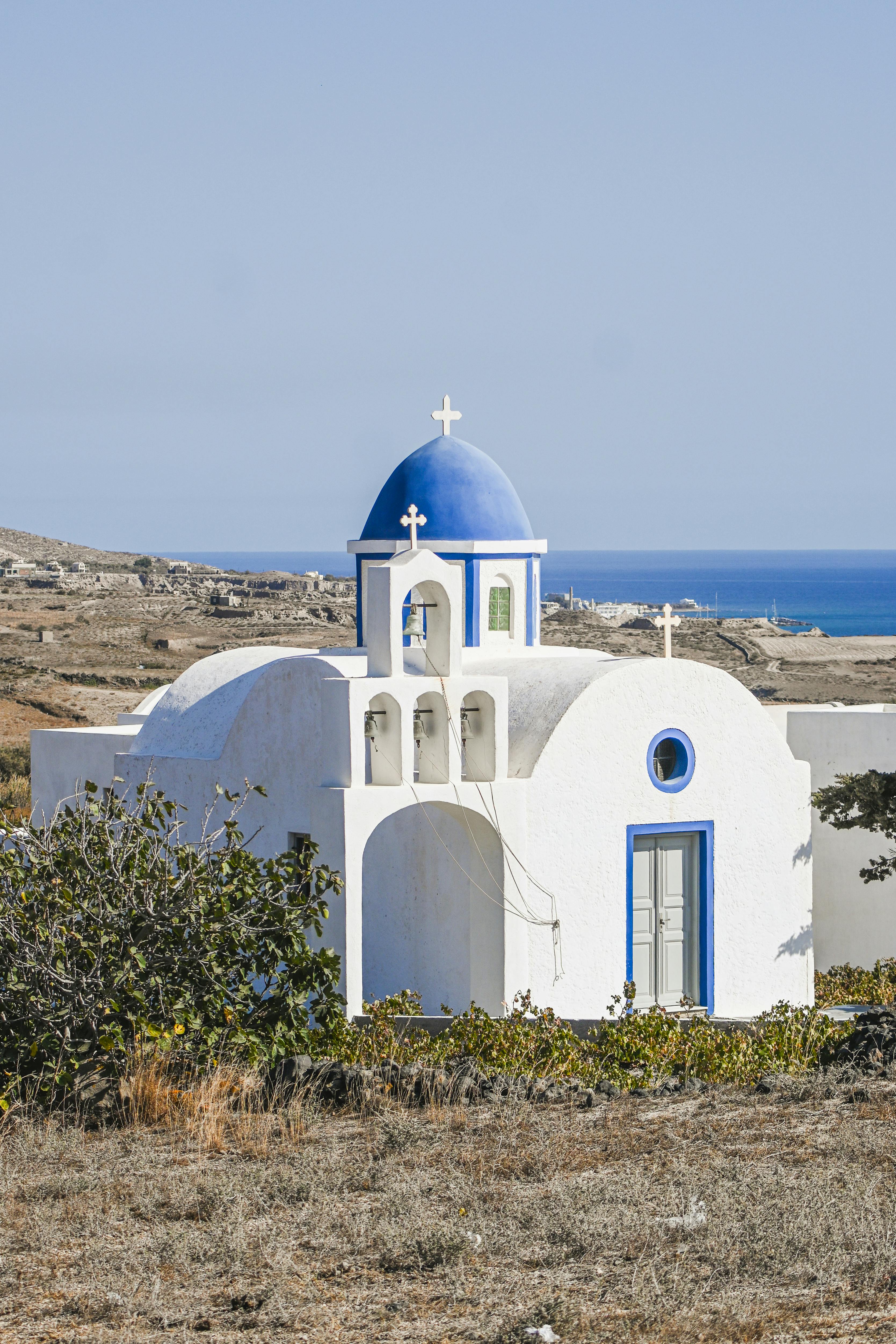 Scenic View of Fira's Iconic Blue Domes in Greece · Free Stock Photo