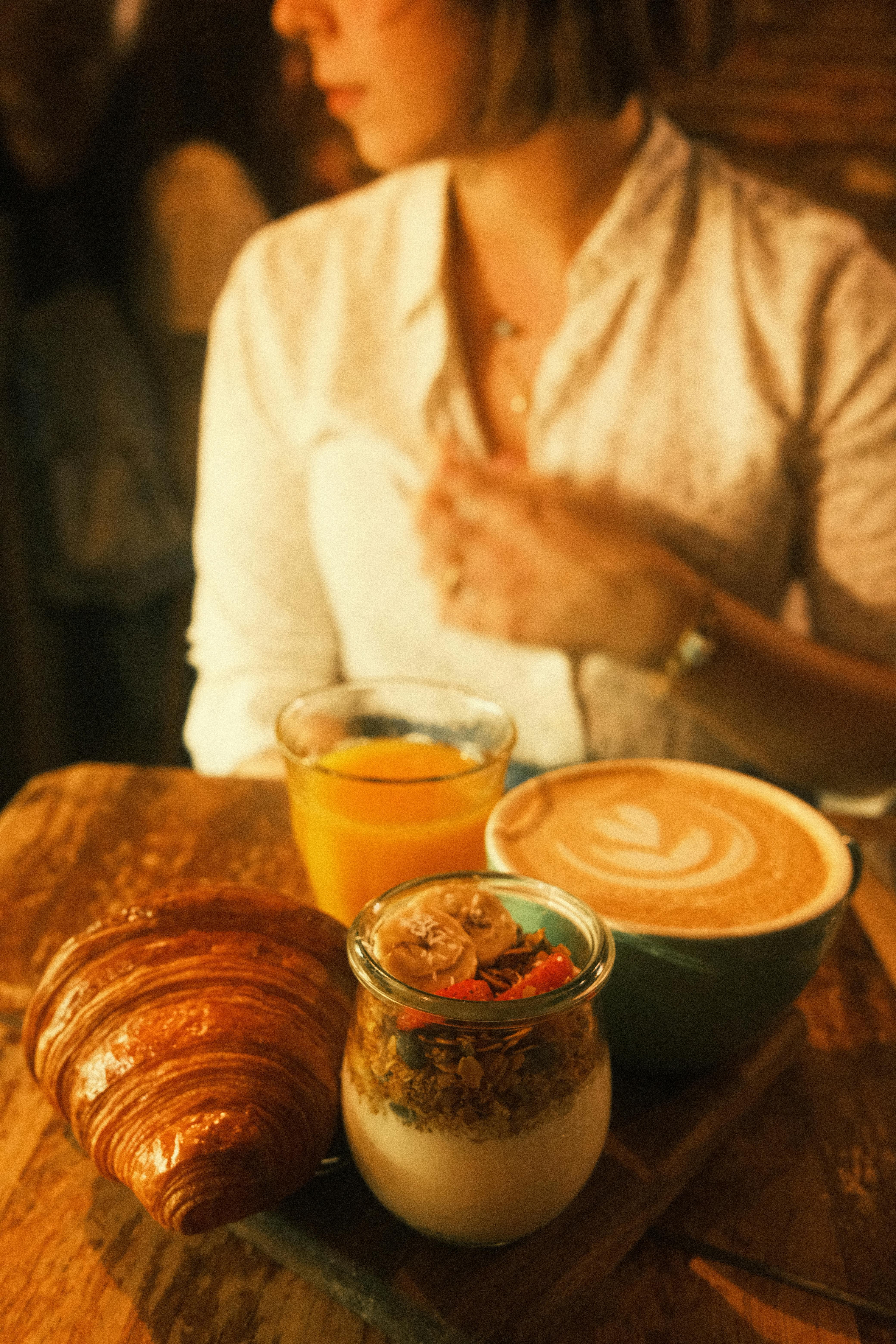 Cozy Cafe Breakfast with Croissant and Cappuccino · Free Stock Photo