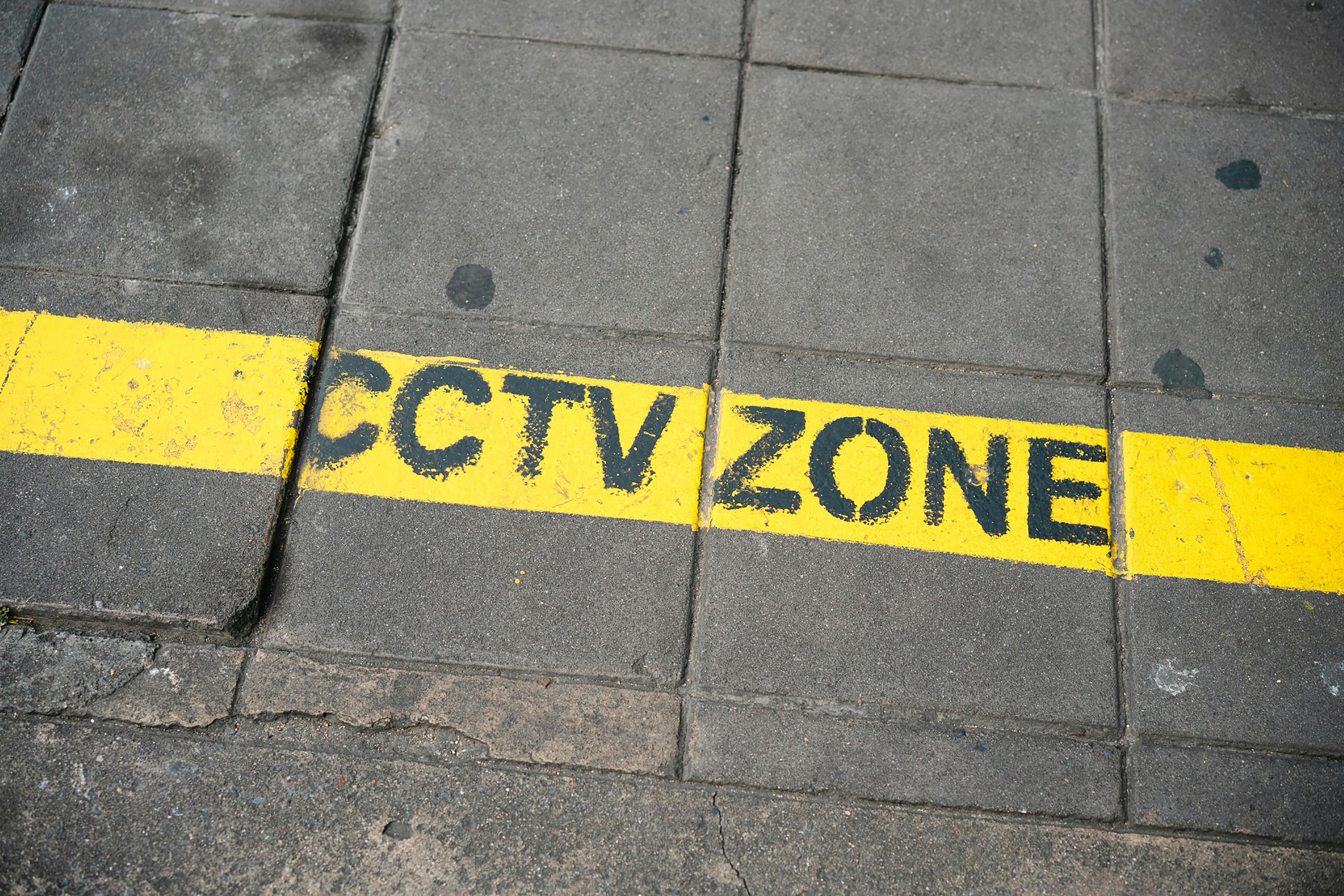 CCTV Zone Surveillance Warning Sign on Pavement · Free Stock Photo