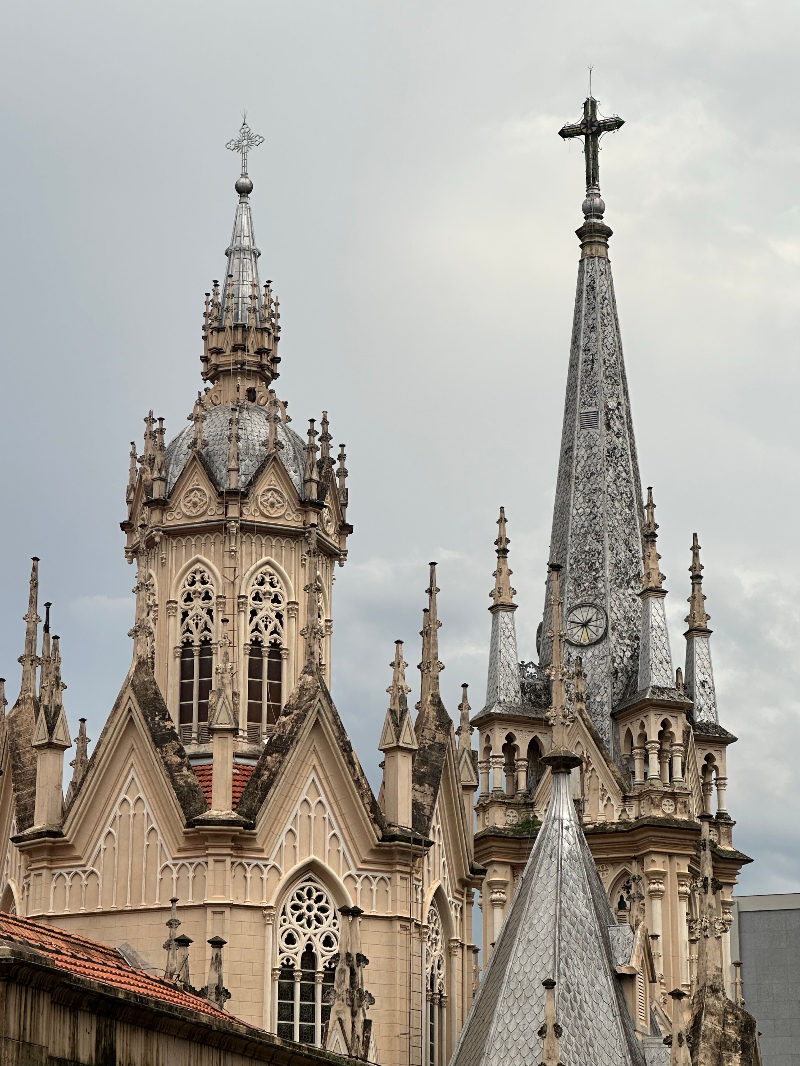 Gothic Cathedral Spires Against Cloudy Sky · Free Stock Photo