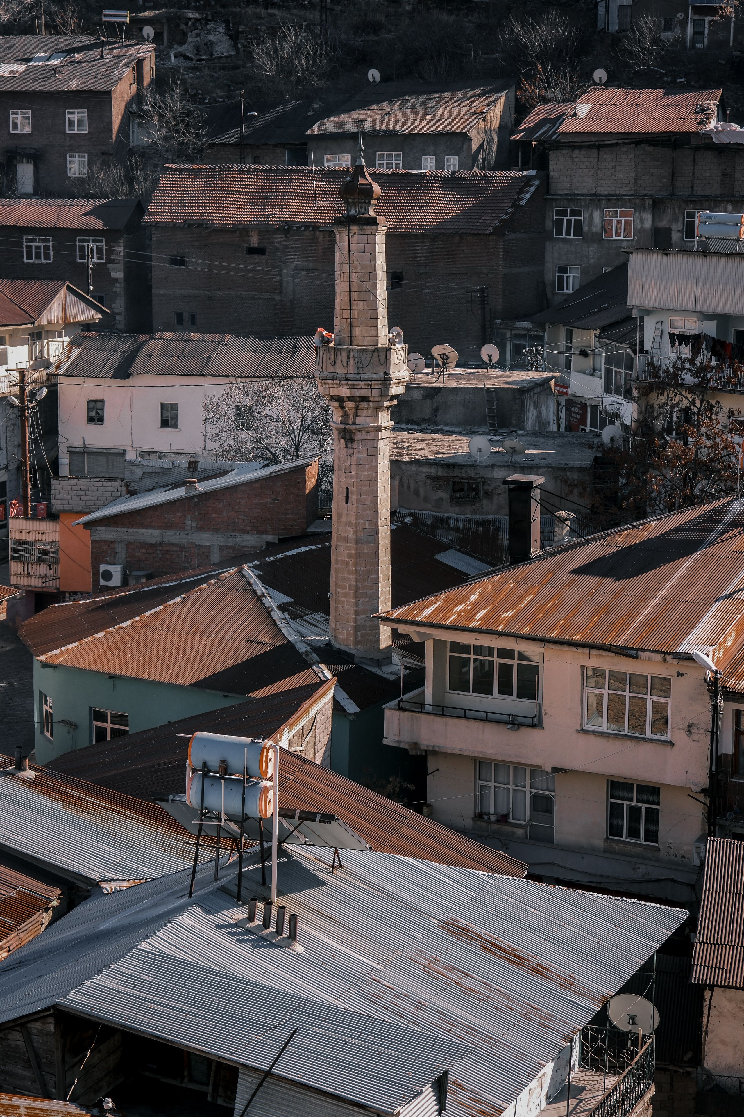 Aerial View of Rustic Rooftops and Minaret · Free Stock Photo