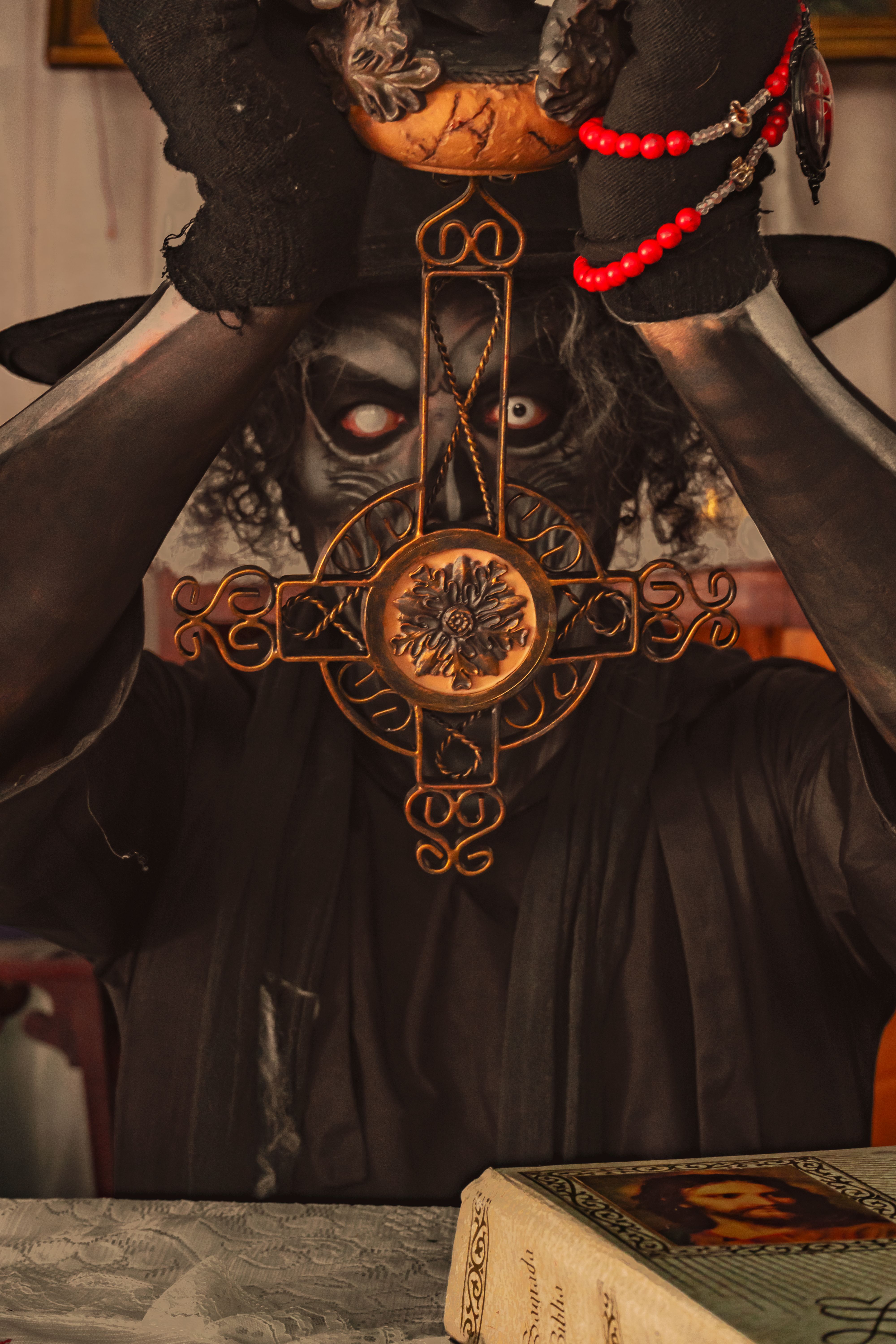Gothic Figure Holding Ornate Cross Symbol · Free Stock Photo