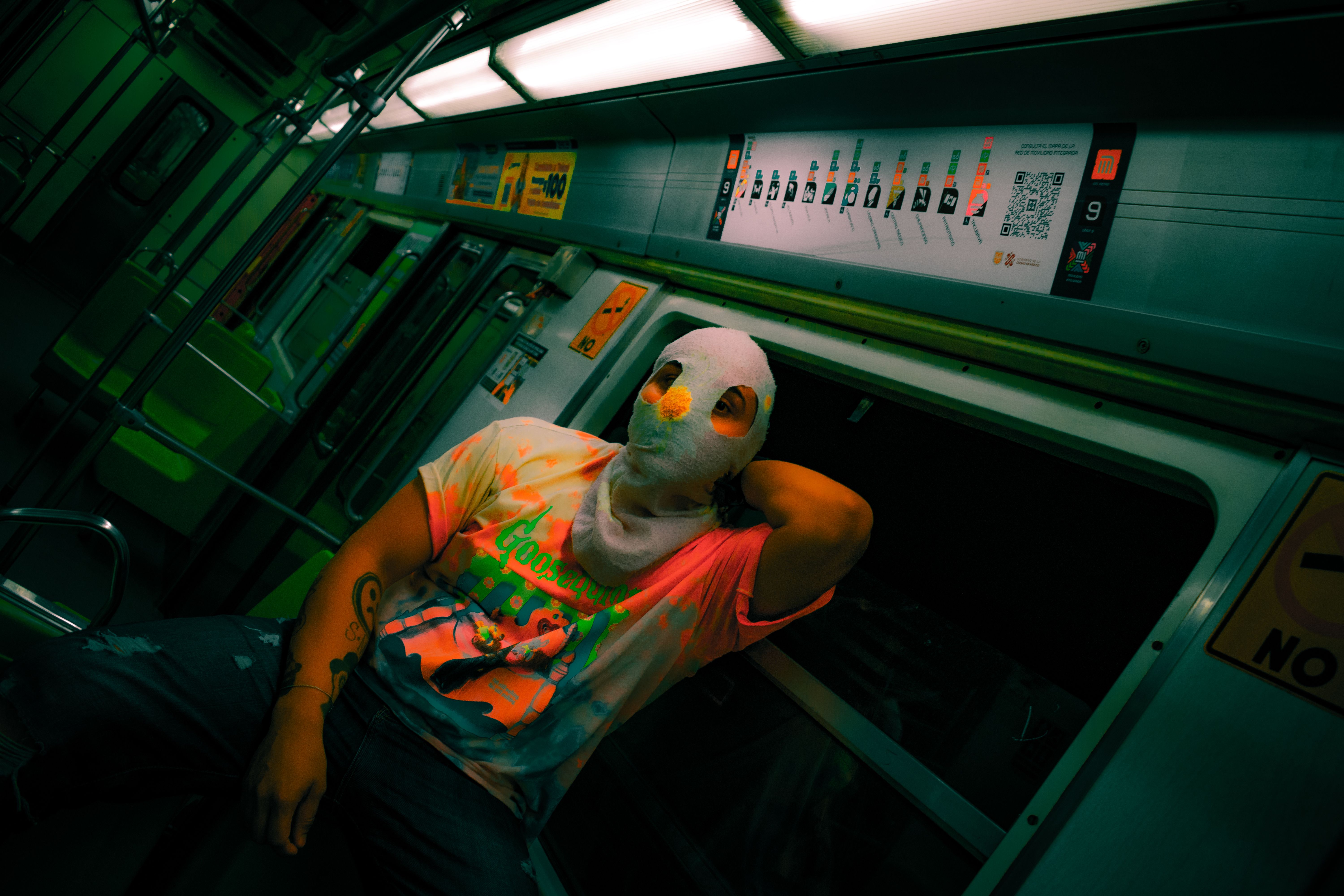 Man with Mask in Moody Subway Setting · Free Stock Photo
