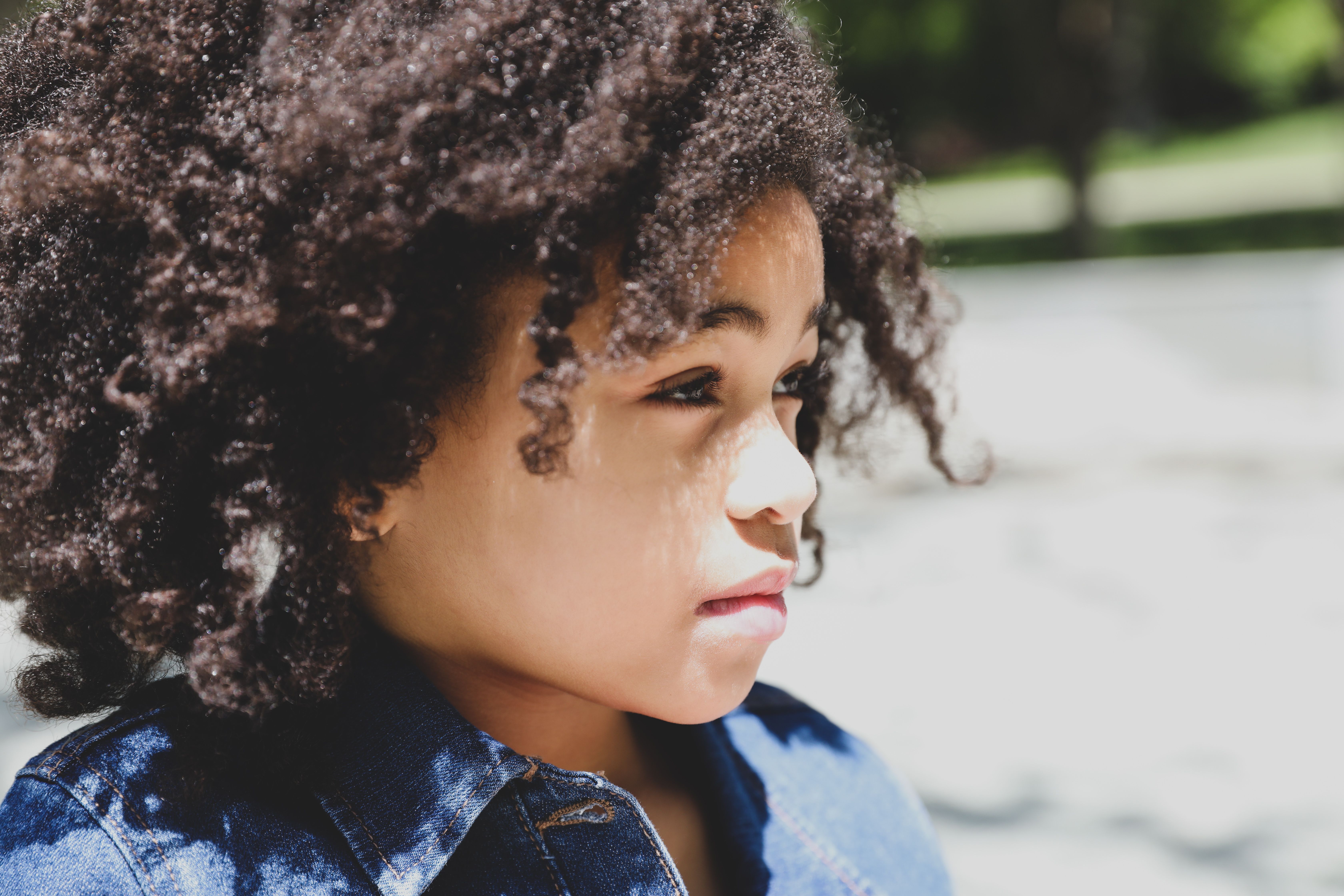 Portrait of a Child in Bright Sunlight · Free Stock Photo