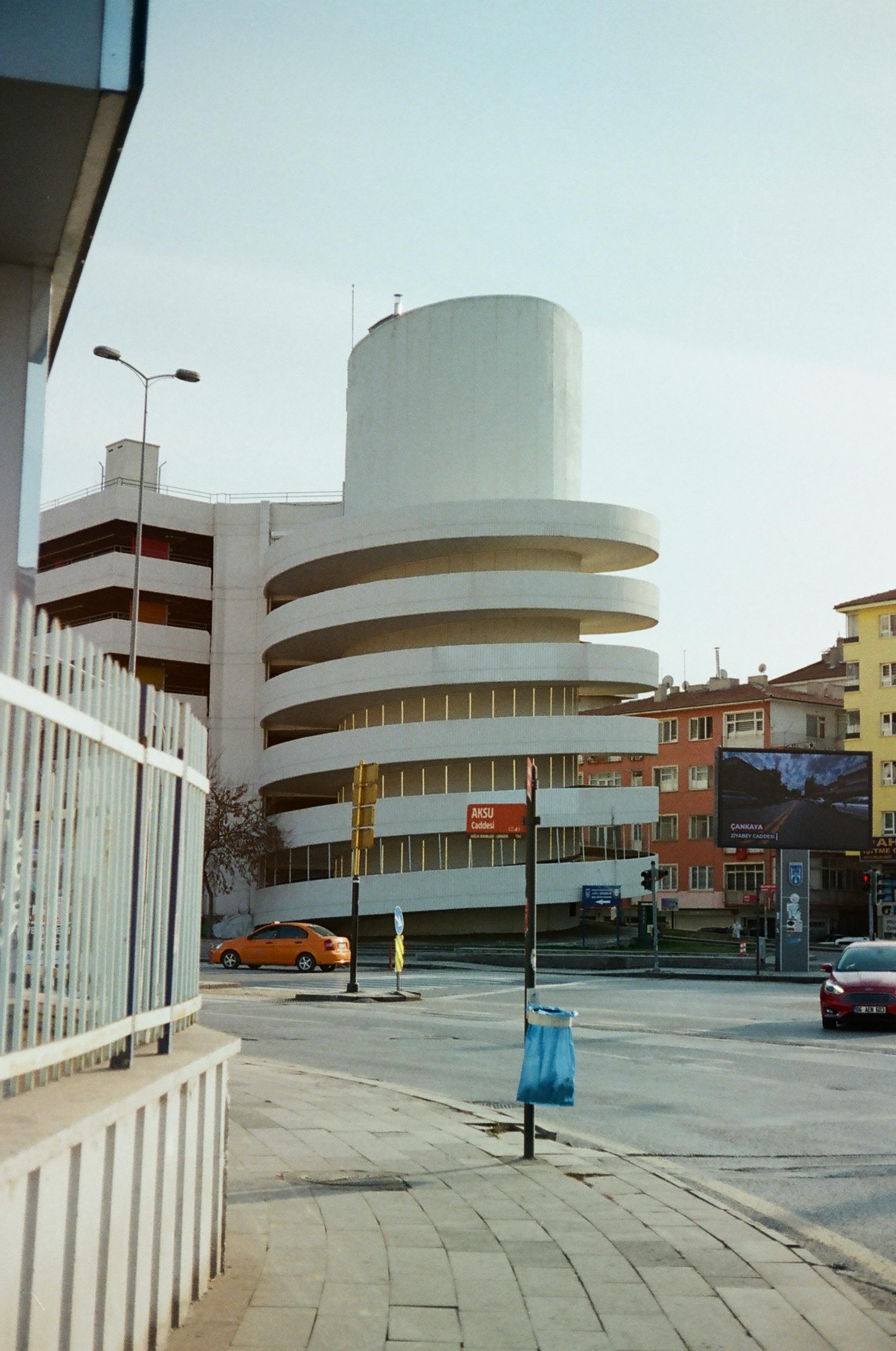 Modern Spiral Parking Garage in Urban Setting · Free Stock Photo