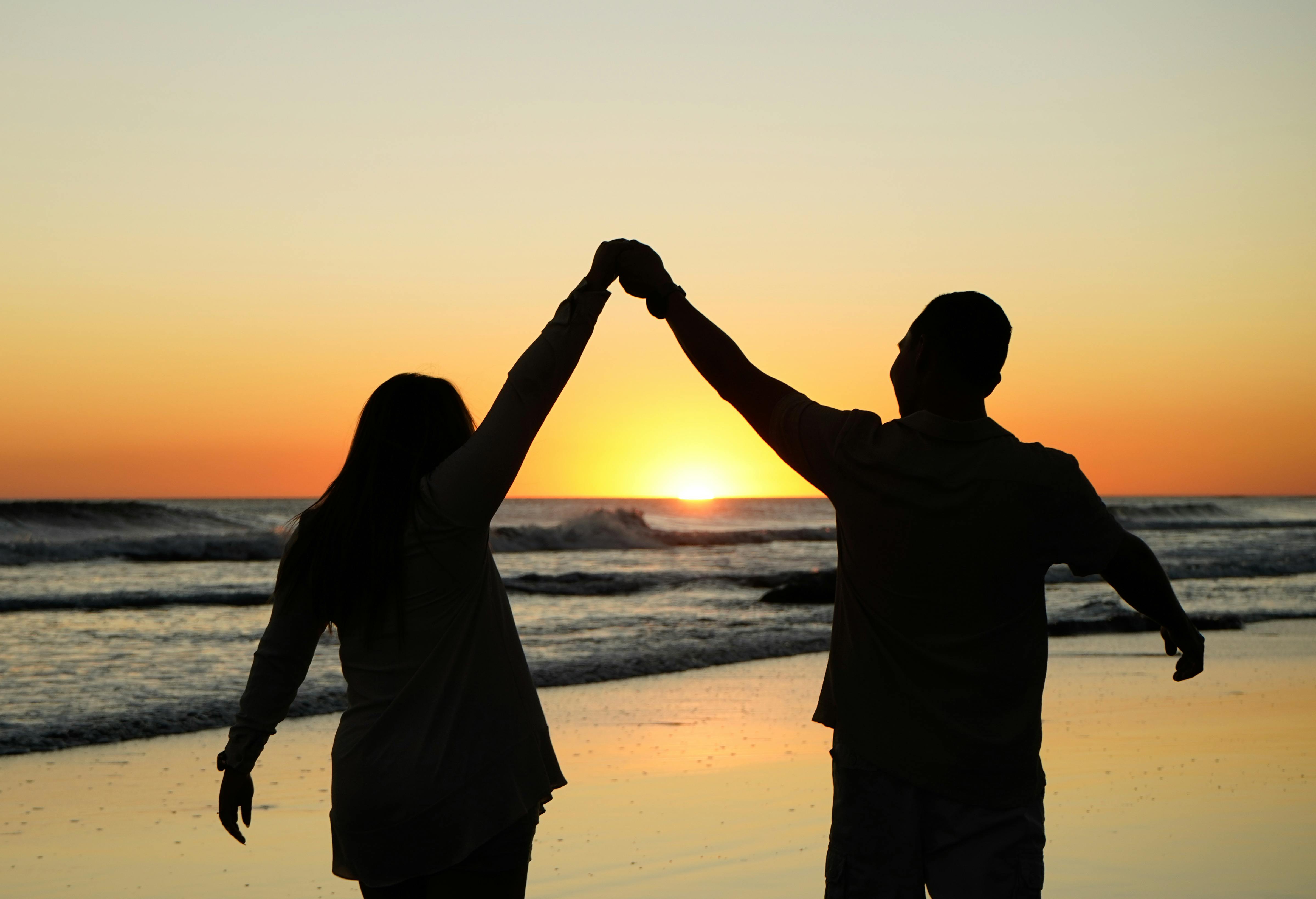 Romantic Couple Dancing at Beach Sunset · Free Stock Photo