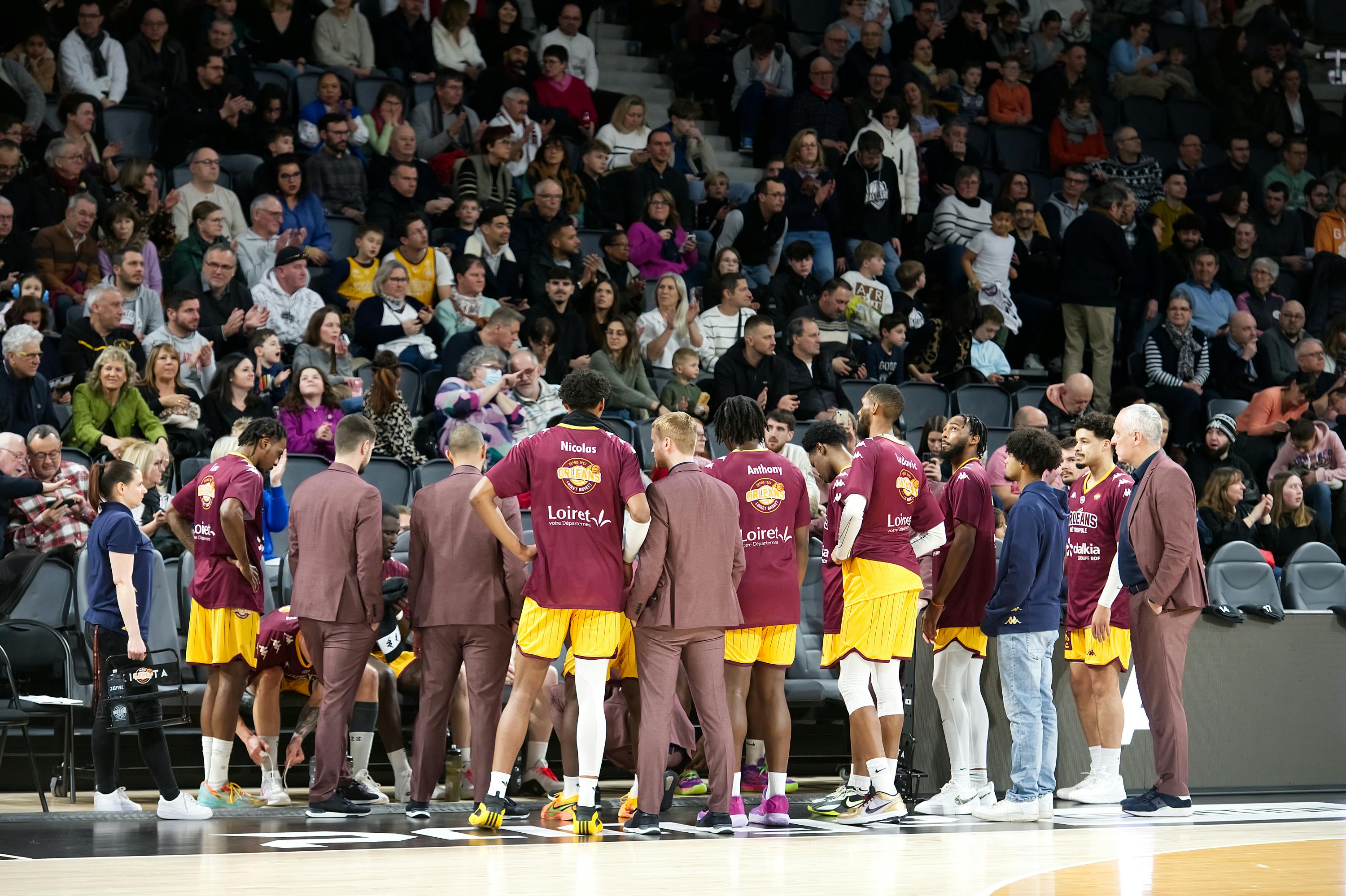 Basketball Team Huddle During Game Timeout · Free Stock Photo