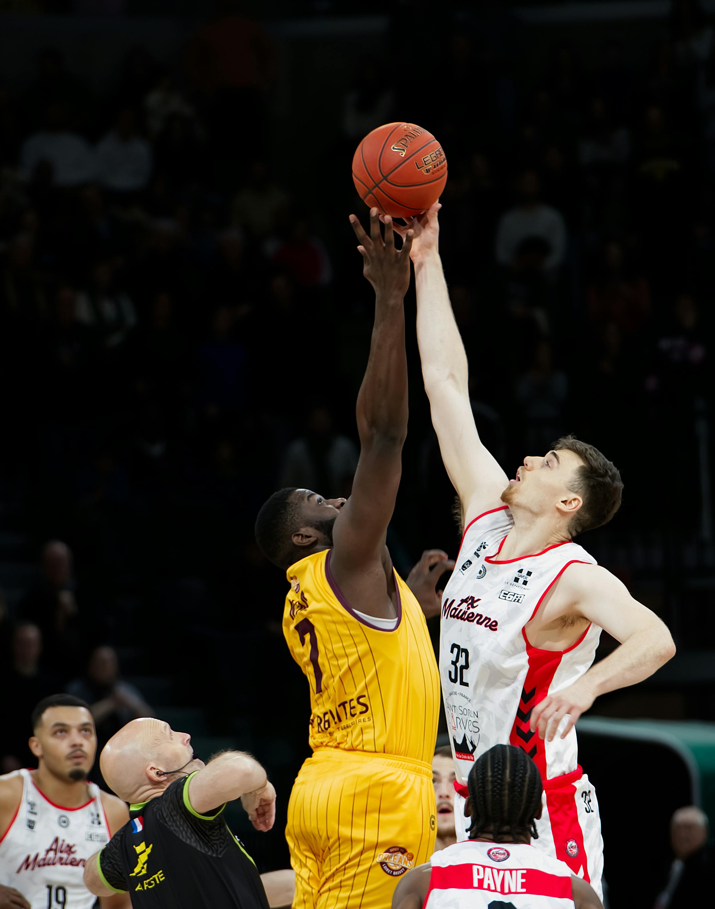 Intense Basketball Tip-Off During Competitive Game · Free Stock Photo