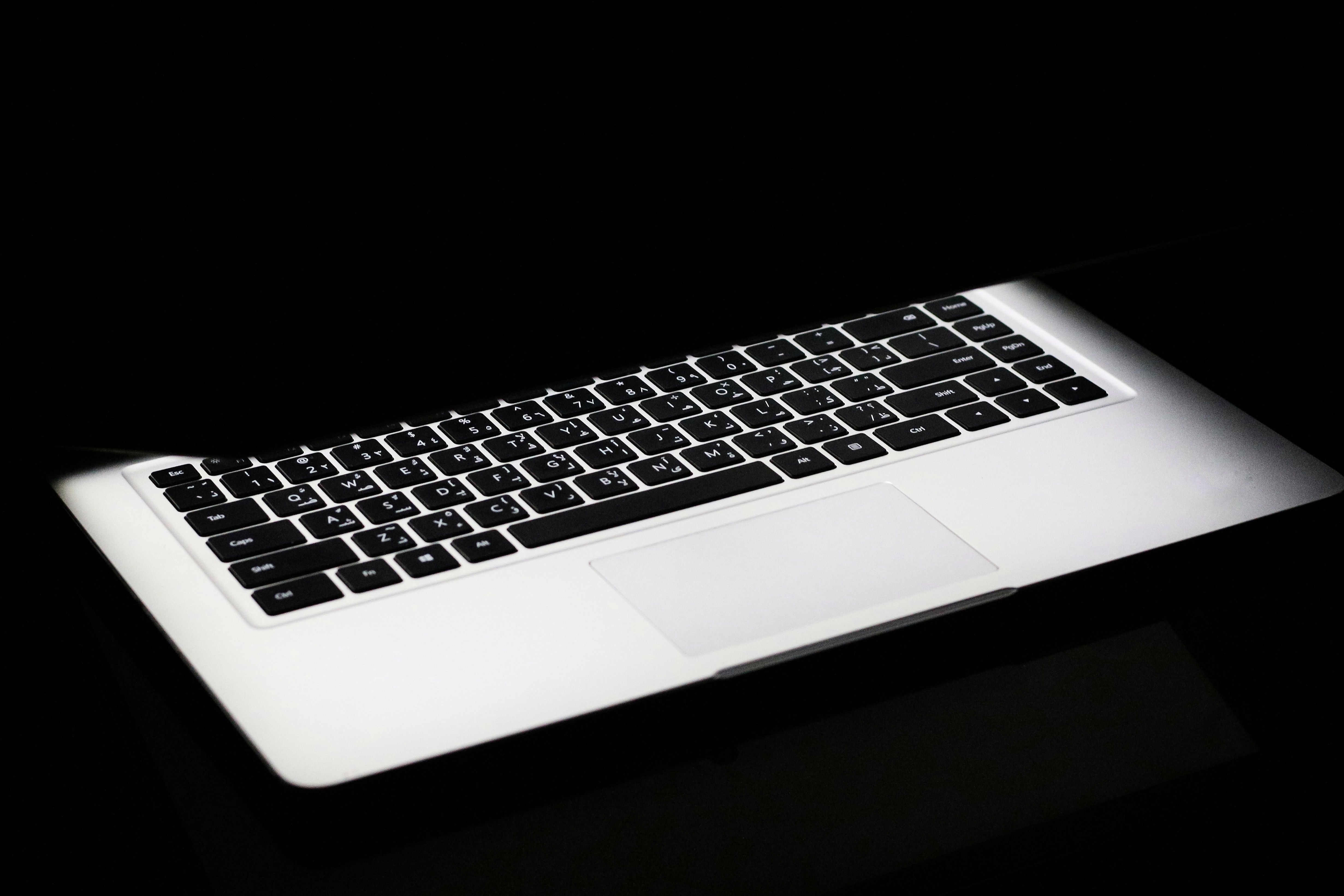 Sleek Modern Laptop with Illuminated Keyboard · Free Stock Photo