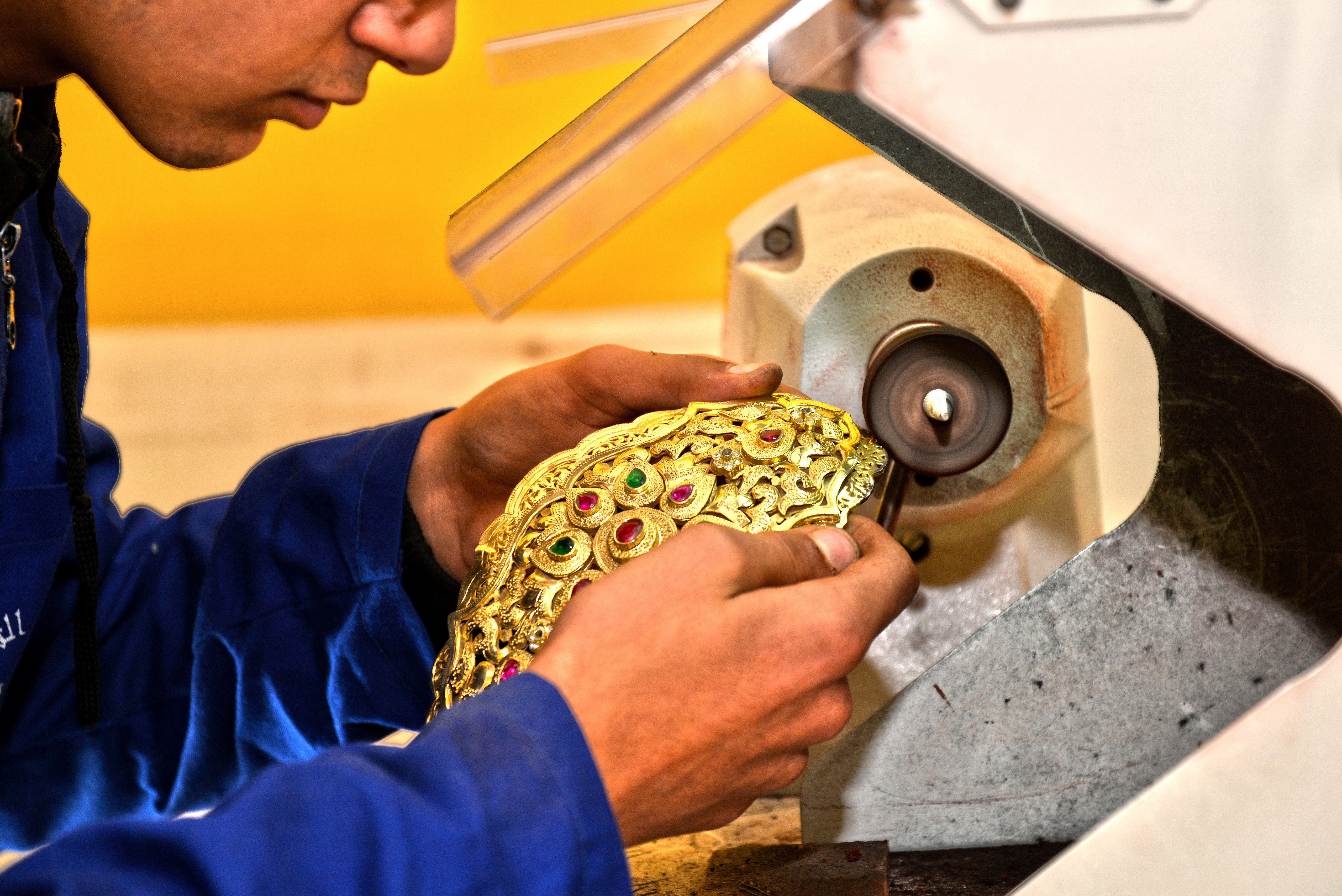 Craftsman Polishing Ornate Gold Jewelry in Fès Workshop · Free Stock Photo