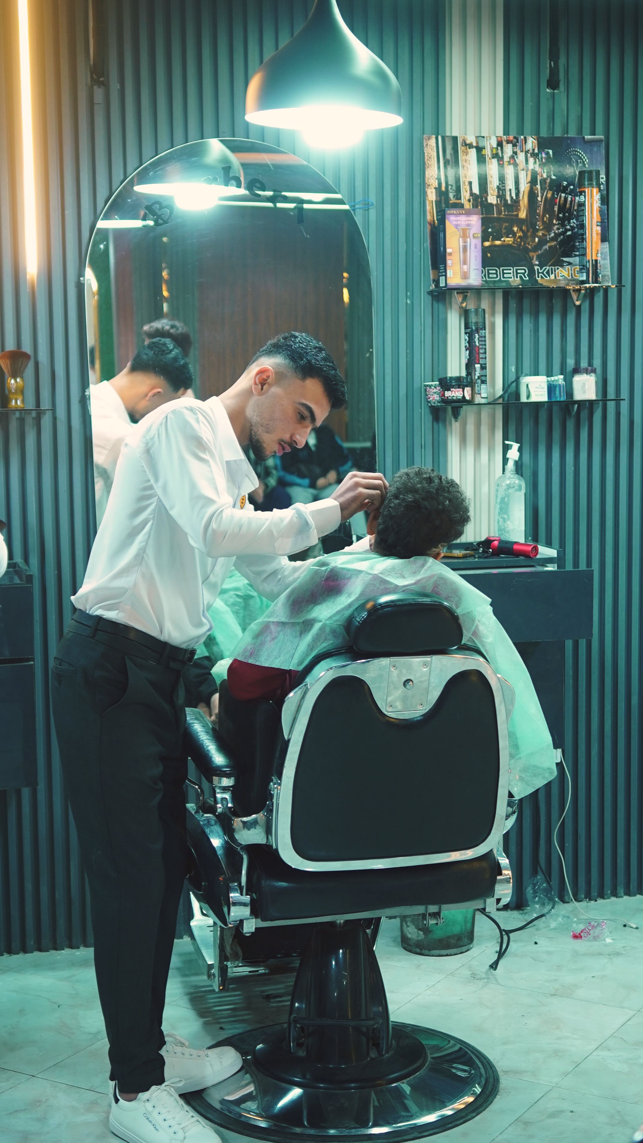 Barber in Egypt Styling Customer's Hair · Free Stock Photo