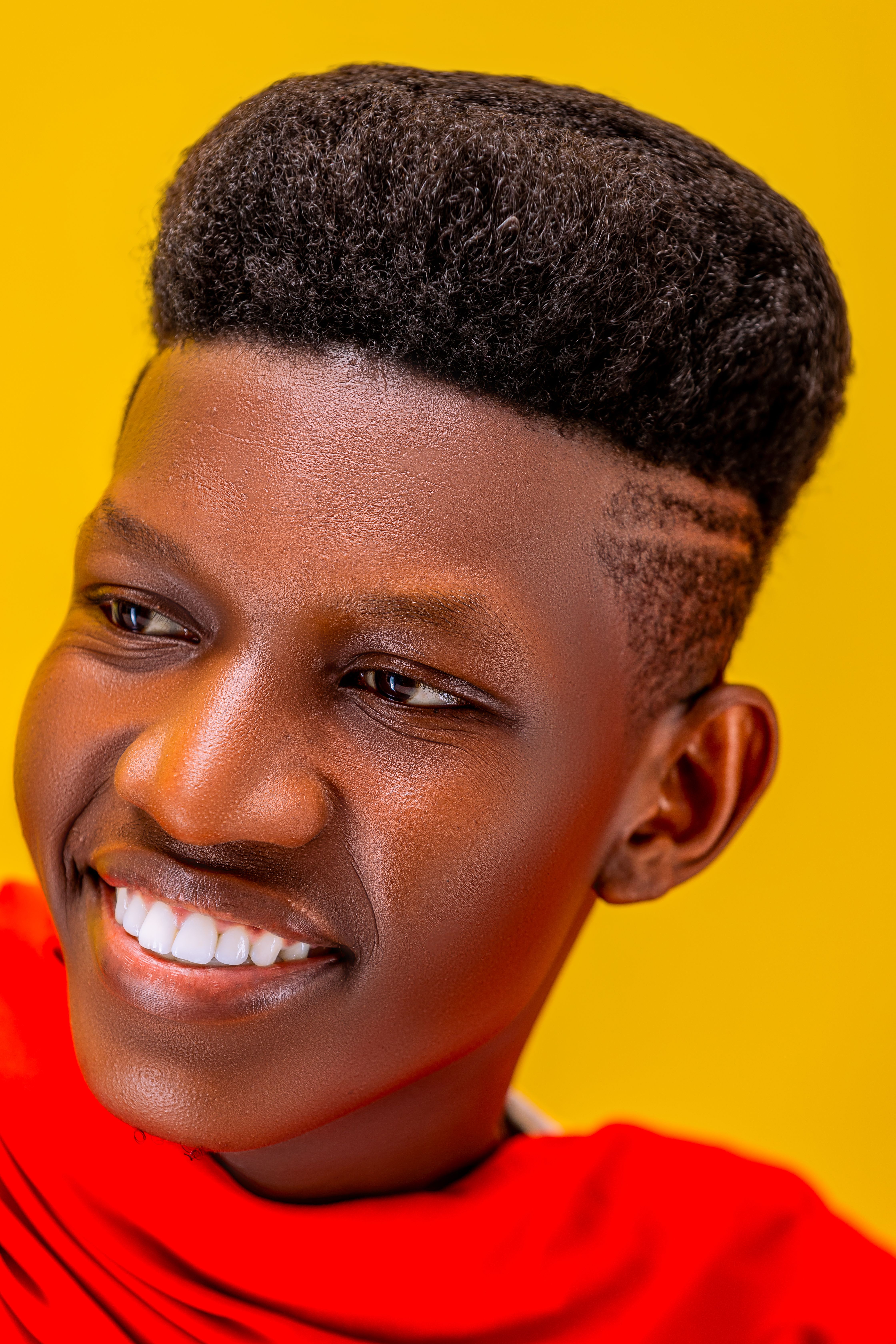 Portrait of a Smiling Young Man on Yellow Background · Free Stock Photo