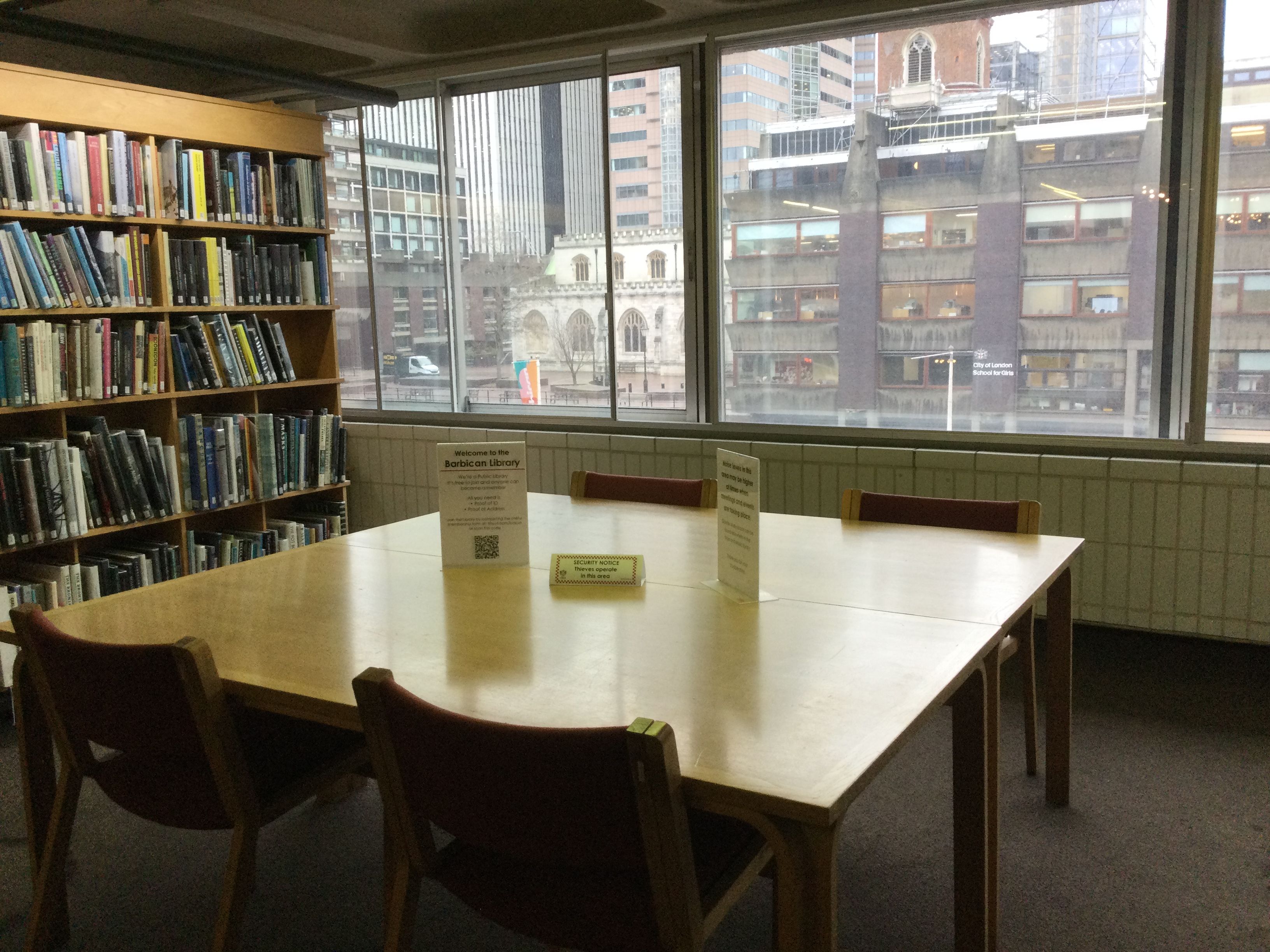 Quiet Library Reading Room with Cityscape View · Free Stock Photo