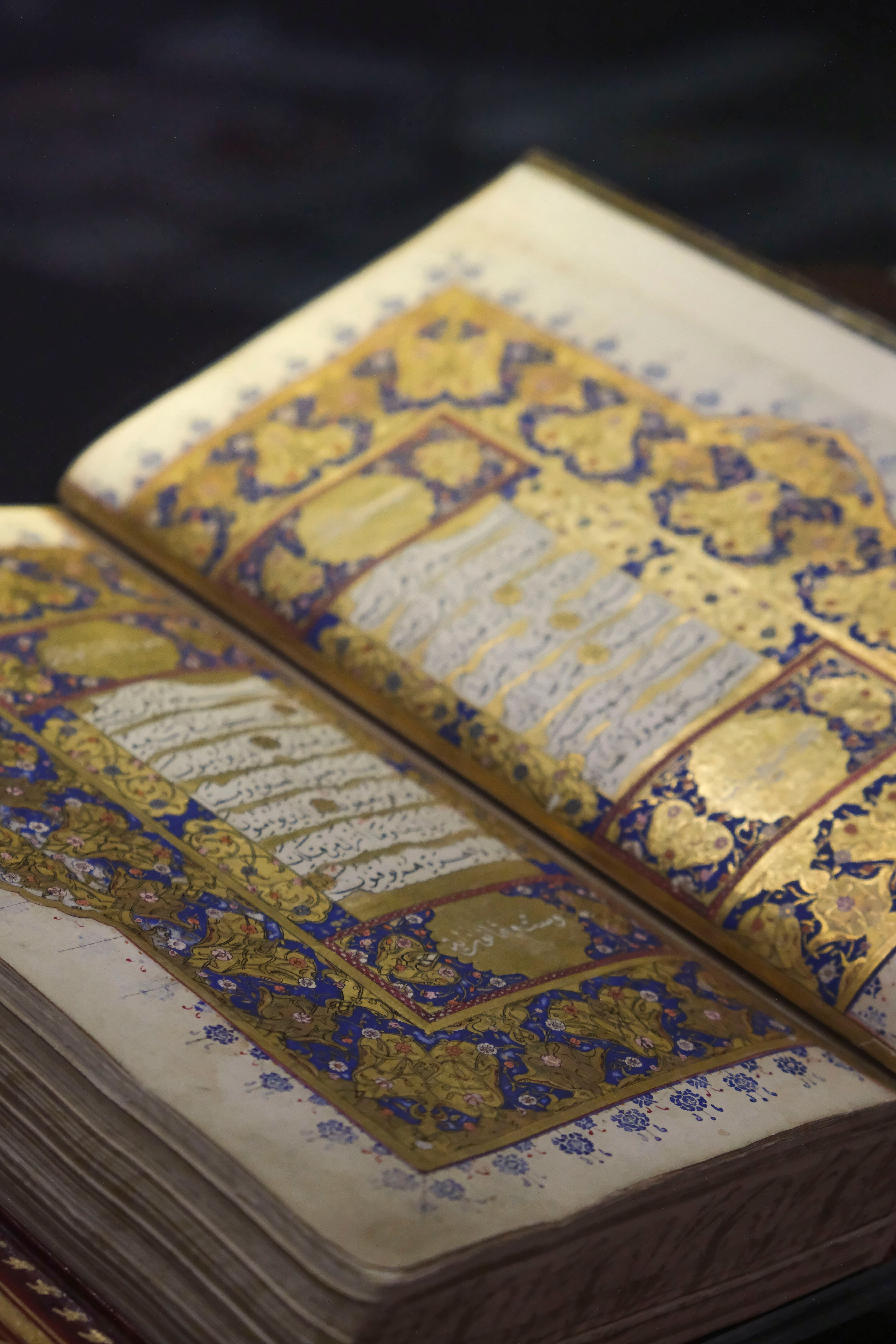 Illuminated Manuscript with Ornate Islamic Art · Free Stock Photo